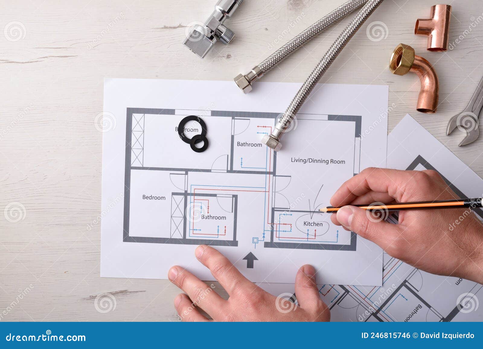 Plumbing Technician Making Notes on a Plan of Water Installation Stock ...