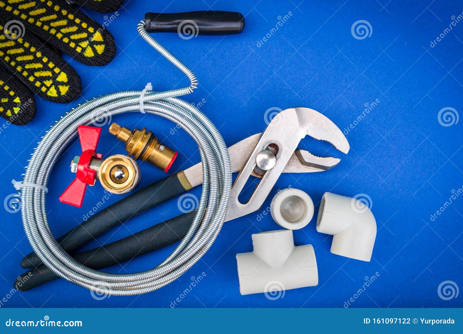Plumbing Tools and Gloves for Connecting Water Hoses on Blue Background ...