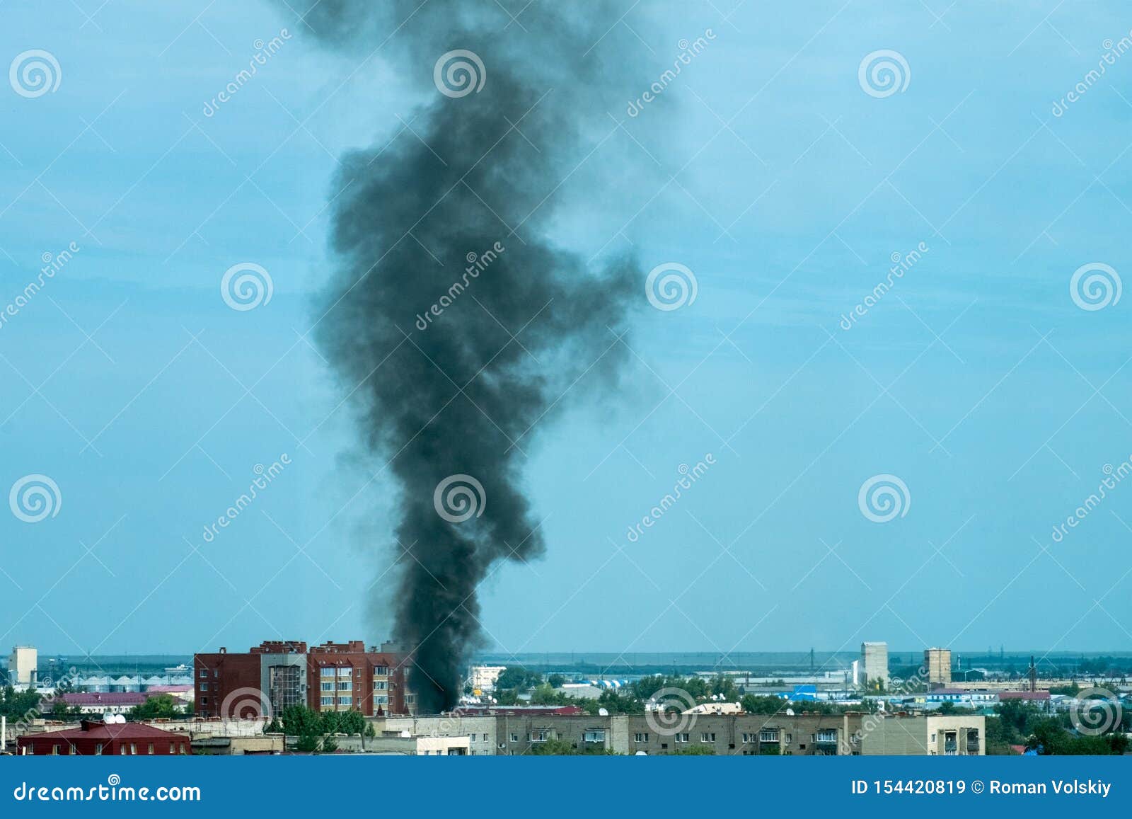 Plume of Black Smoke from a Fire Above City at Sunset. Technogenic ...