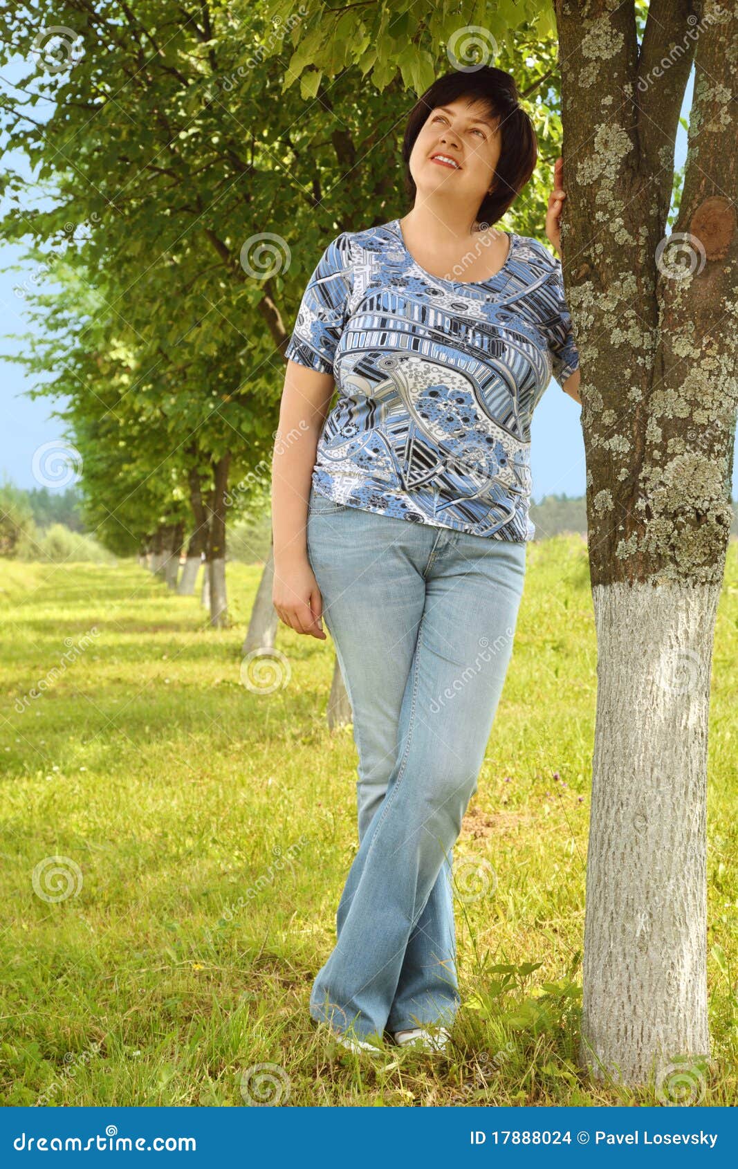 Plumpy Brunette Woman Standing on Lawn Near Tree Stock Photo - Image of ...