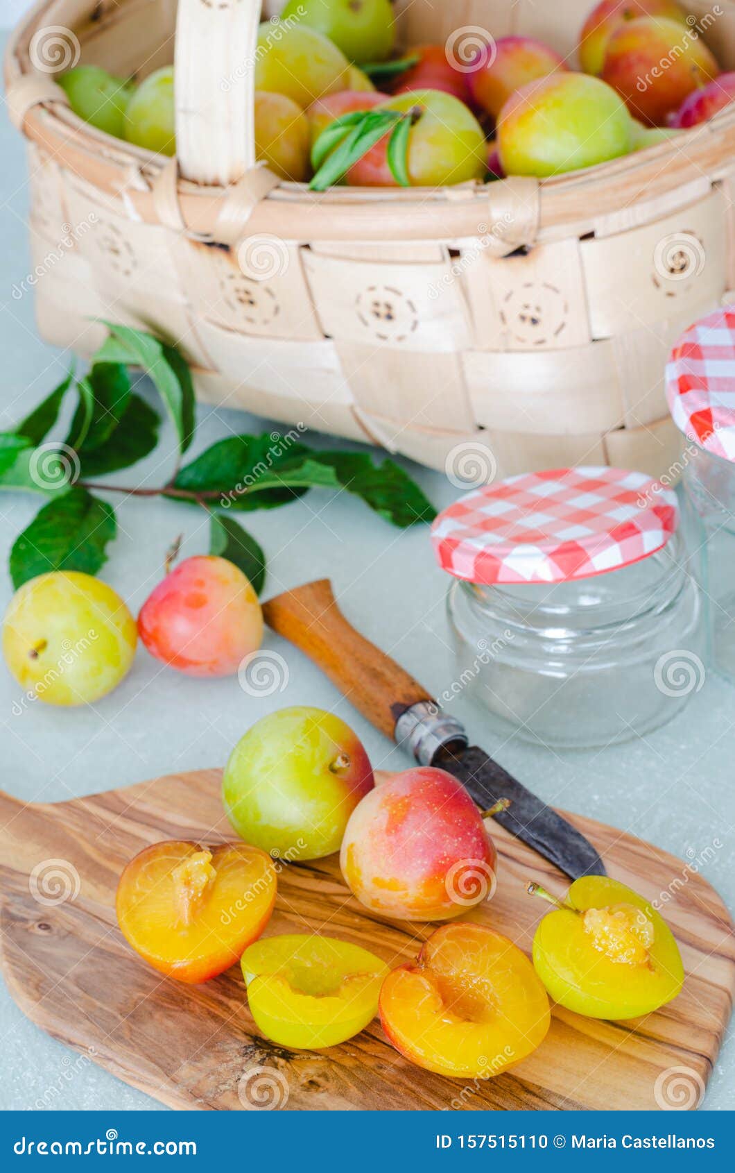 Plums Cut on Kitchen Board on Blue Background Stock Photo - Image of ...
