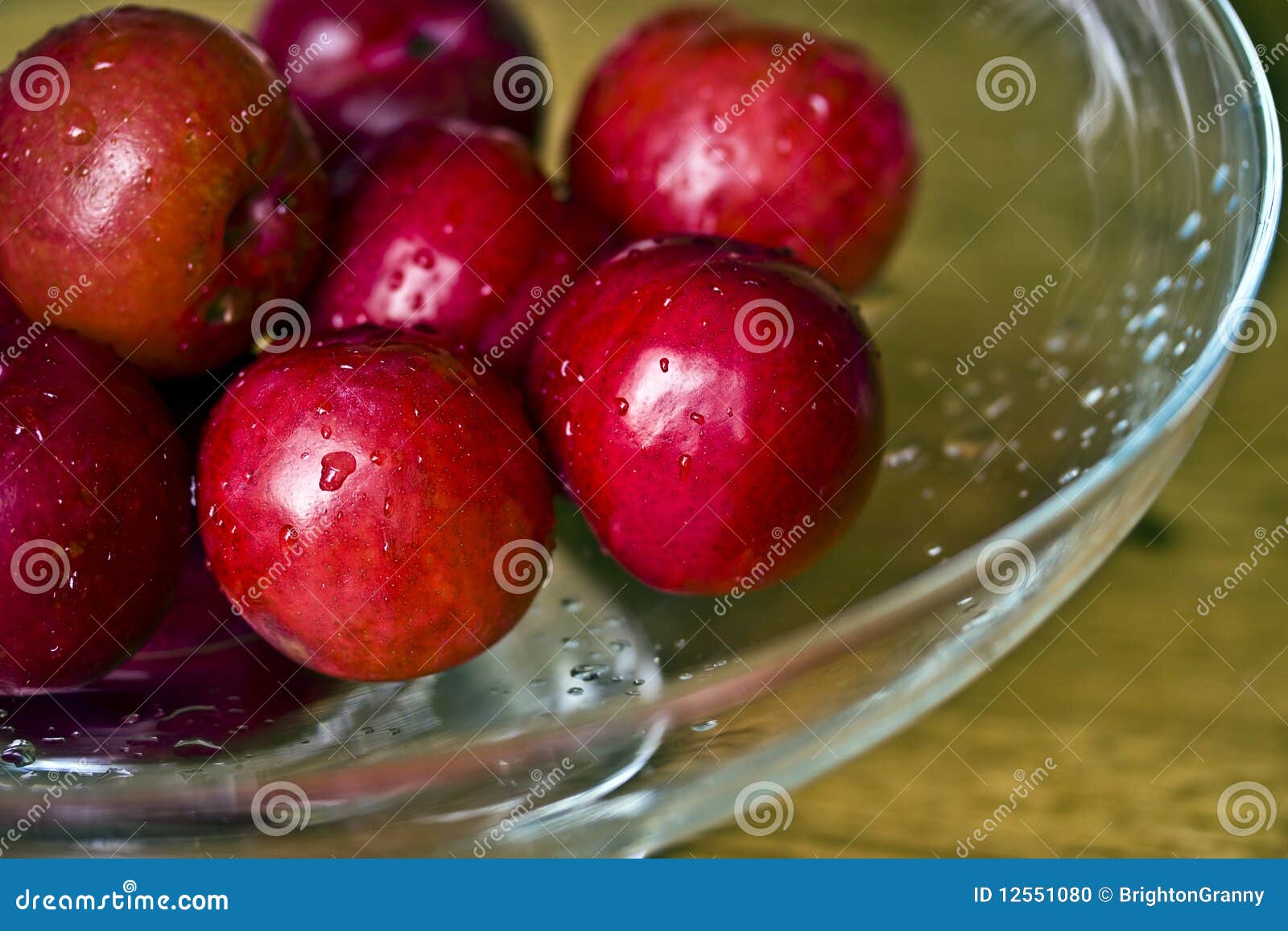 Bright Red Plums in a Glass Bowl. Stock Photo - Image of dark ...