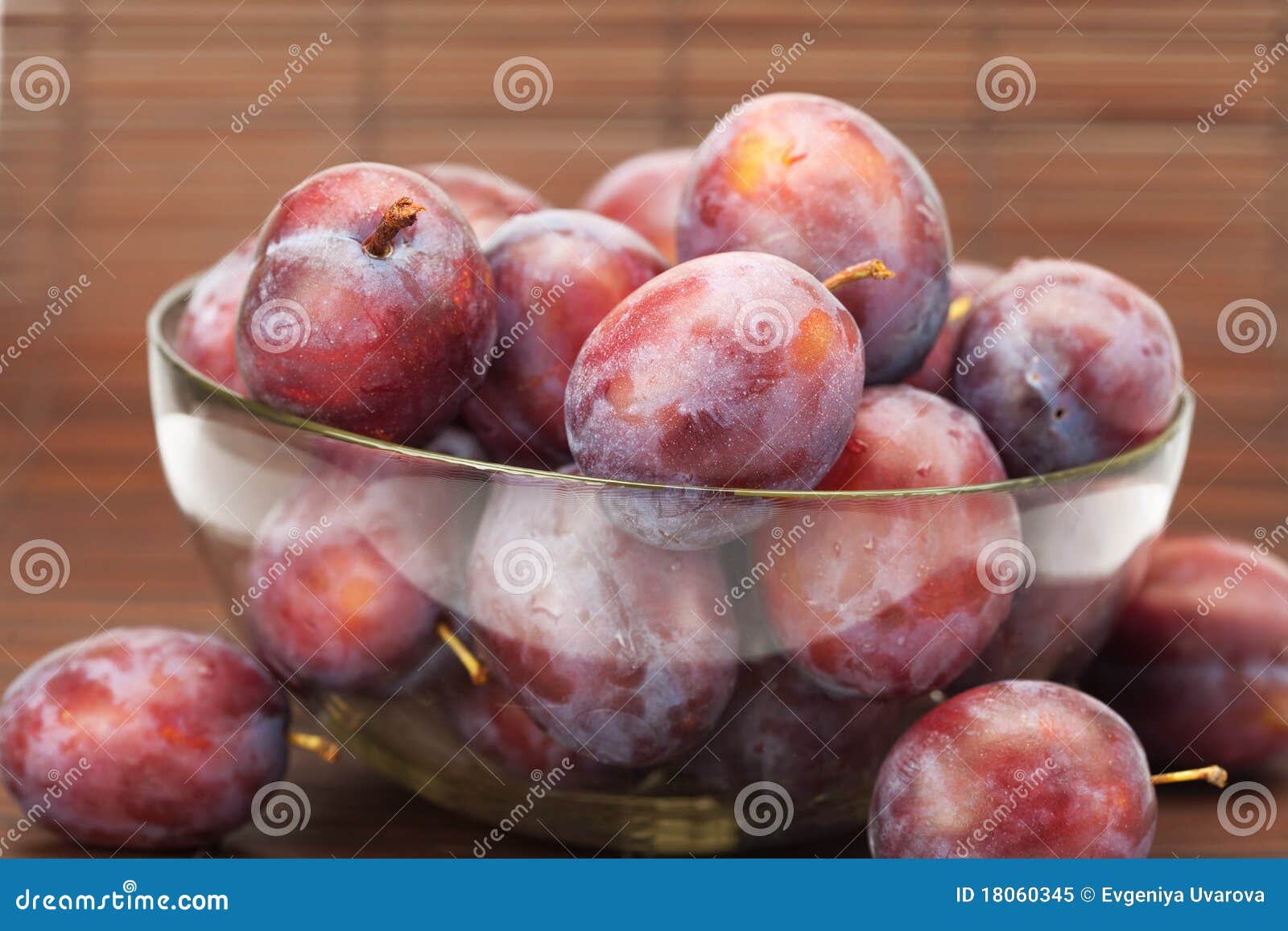 Plums in a glass bowl stock image. Image of purple, juicy - 18060345