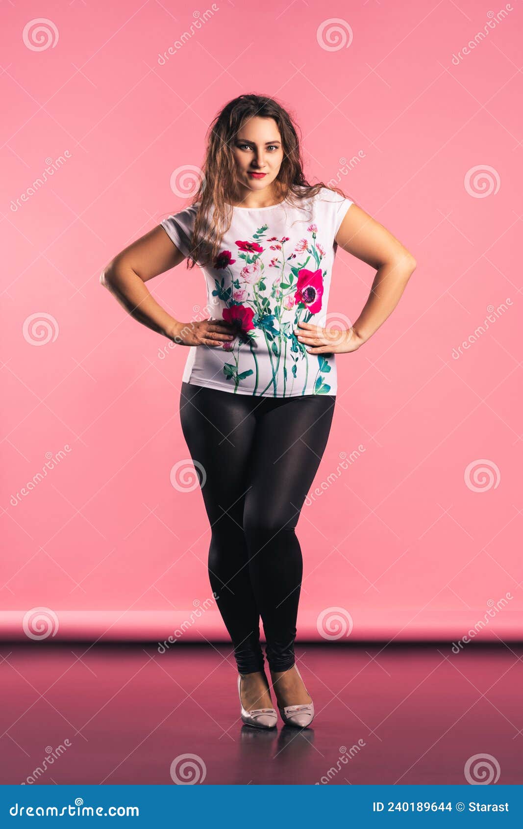 Plus Size Model in Casual Clothes on Pink Background Stock Photo ...