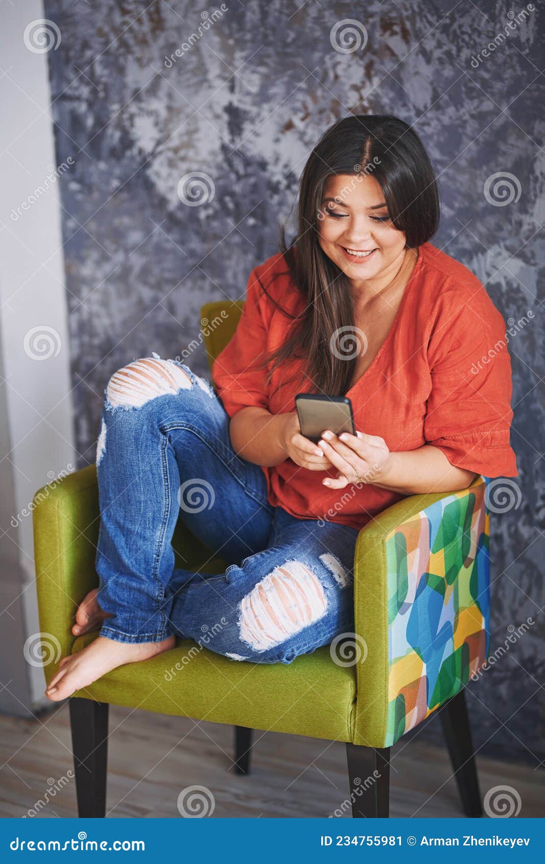 Plus Size Model Sitting on the Chair and Using Smartphone Stock Image ...