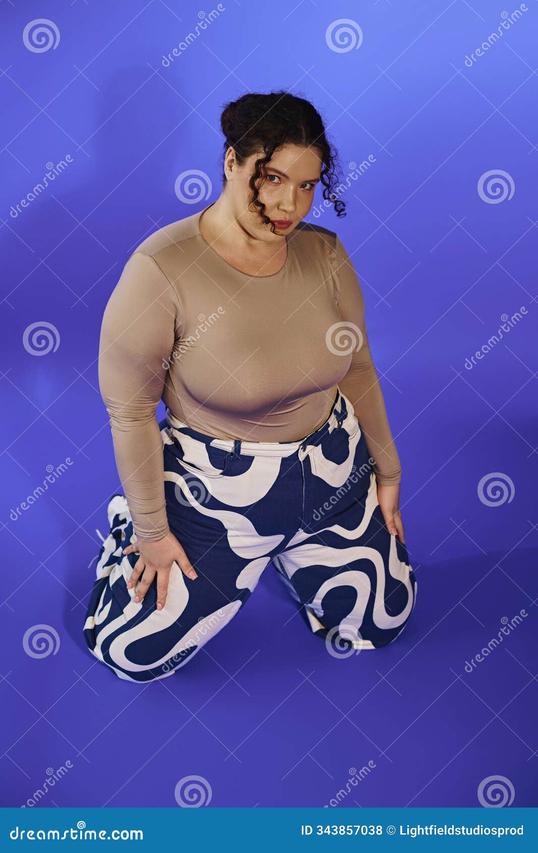 A plus size woman poses on stock photo. Image of striking - 343857038
