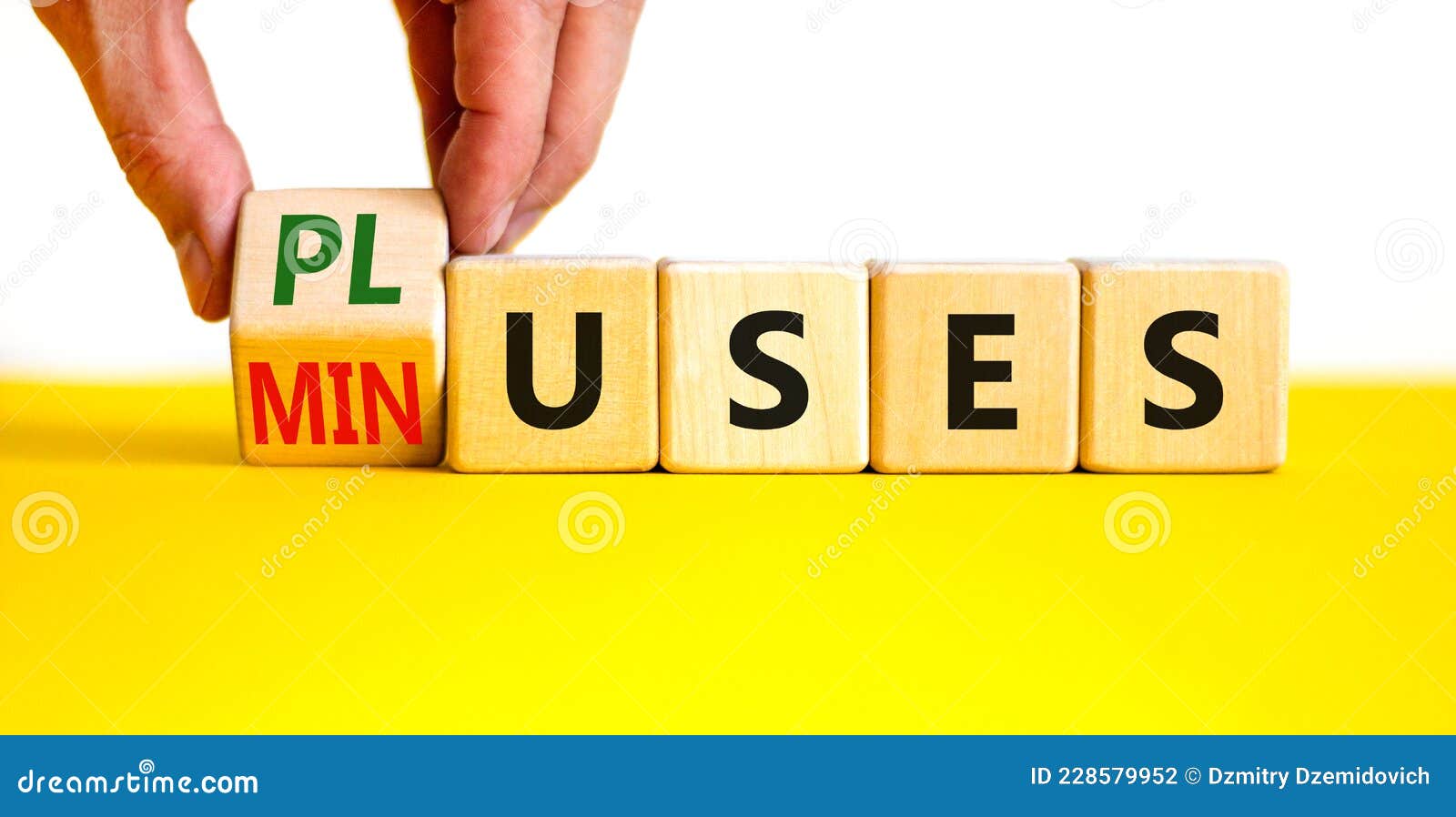 Pluses And Minuses Symbol. Businessman Turns A Wooden Cube And Changes ... Pluses And Minuses Symbol. Businessman Turns A Wooden Cube And Changes ...