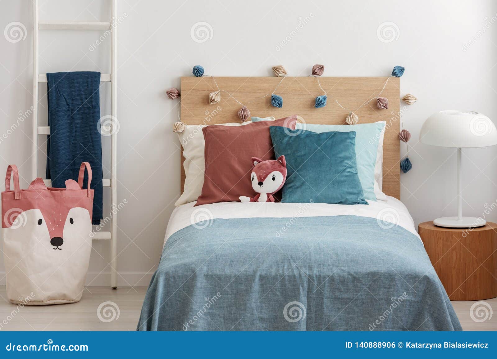 Plush Fox on Singe Bed with Colorful Pillows and Duvet Stock Photo ...