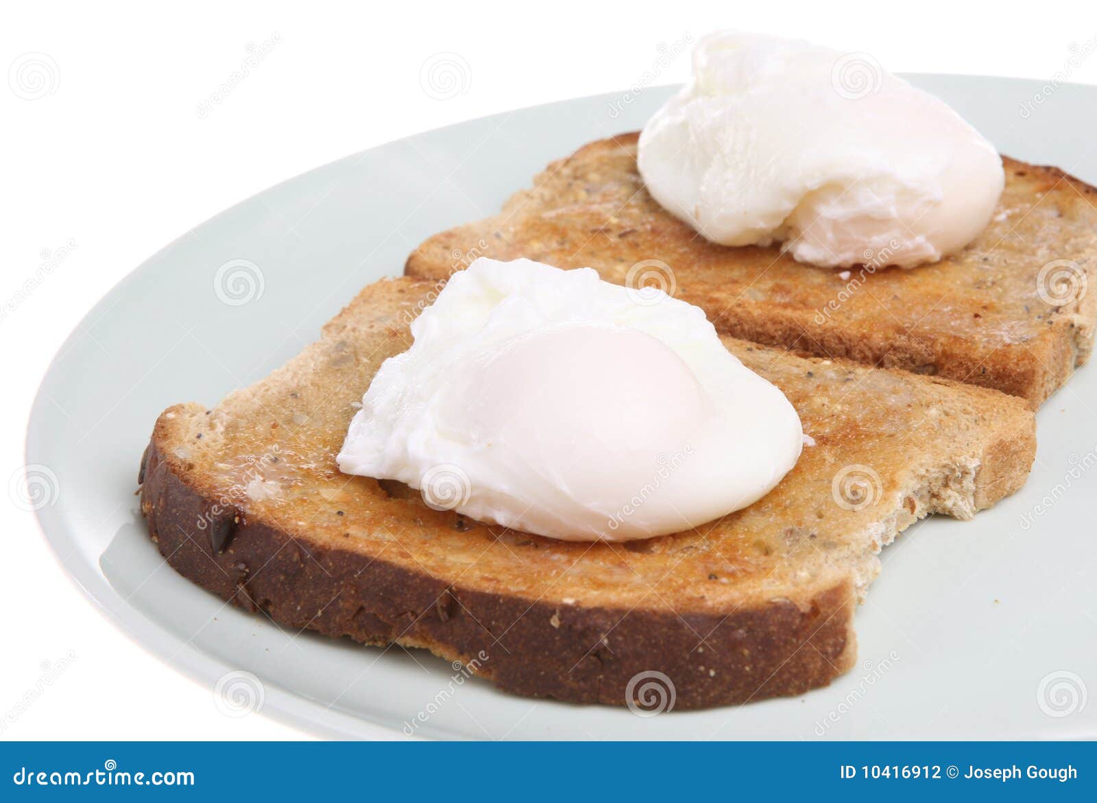 Poached Eggs on Toast stock photo. Image of grain, cooked - 10416912