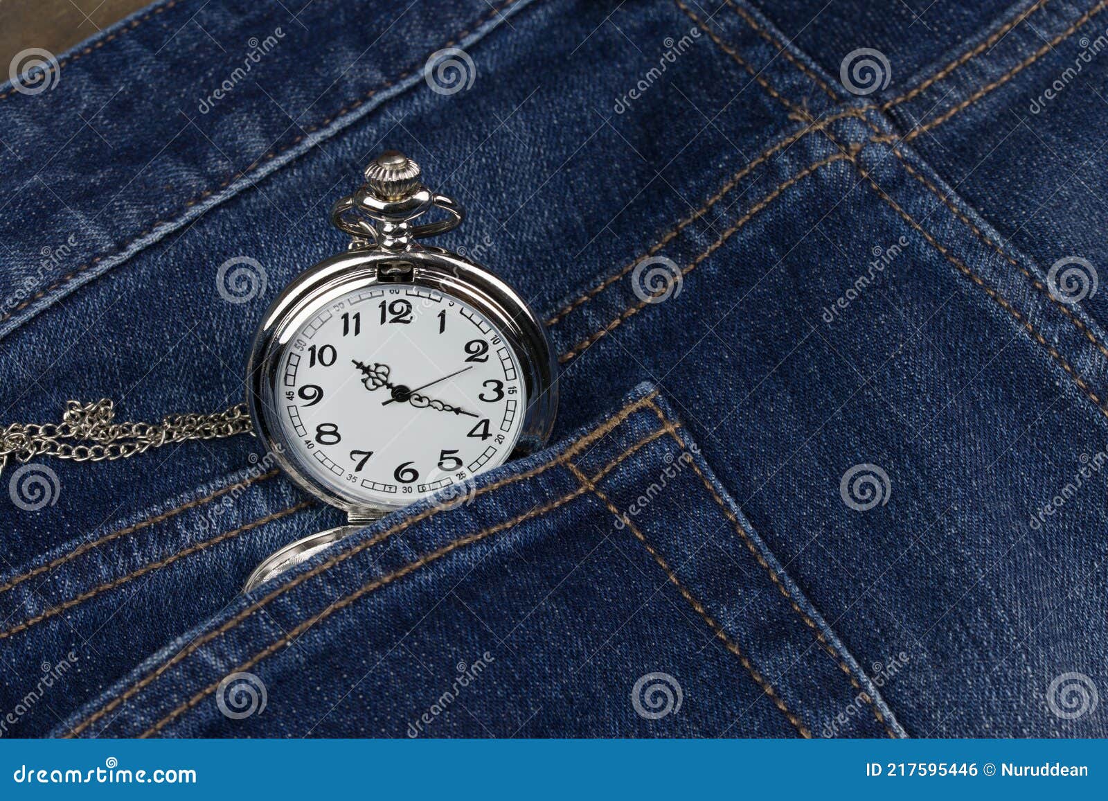 Pocket watch on blue jeans stock photo. Image of texture - 217595446