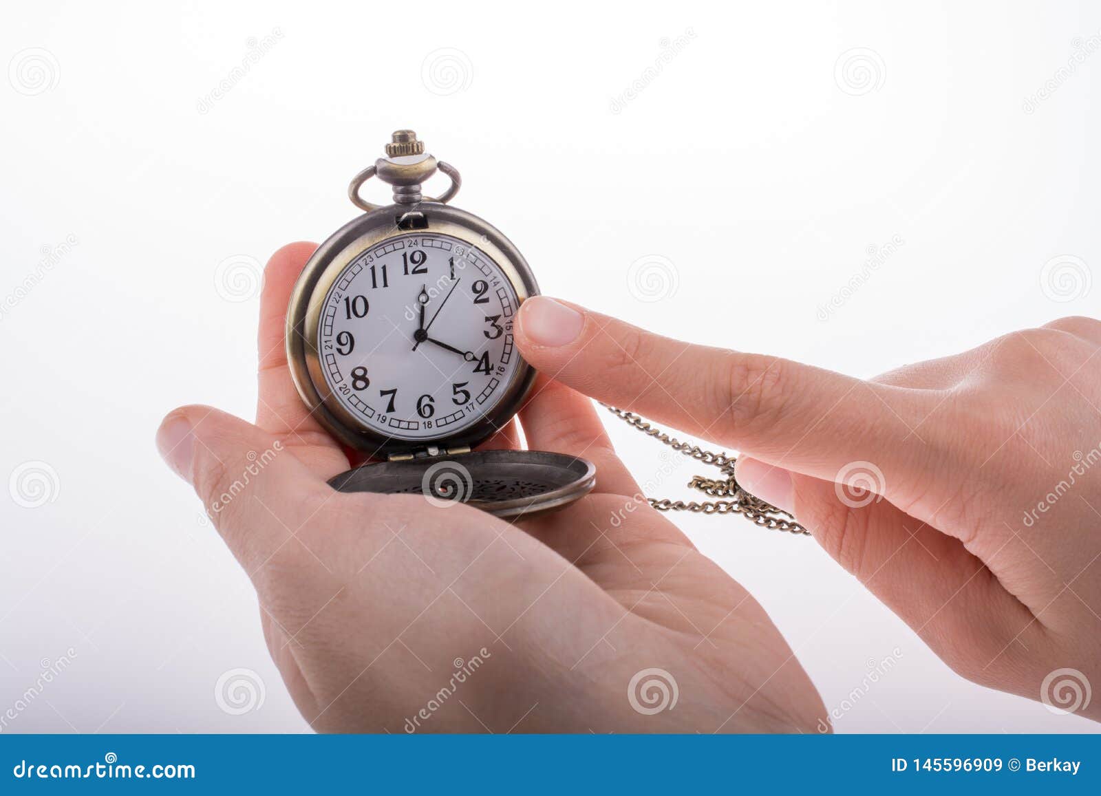 Pocket watch in hand stock image. Image of hand, watch - 145596909
