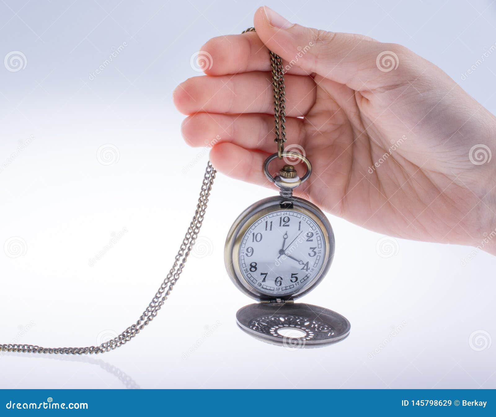 Pocket watch in hand stock image. Image of watch, styled - 145798629