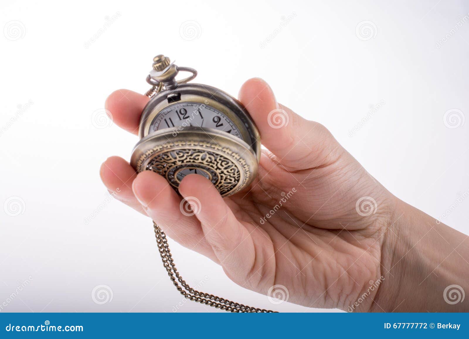 Pocket watch in hand stock photo. Image of watch, ticking - 67777772