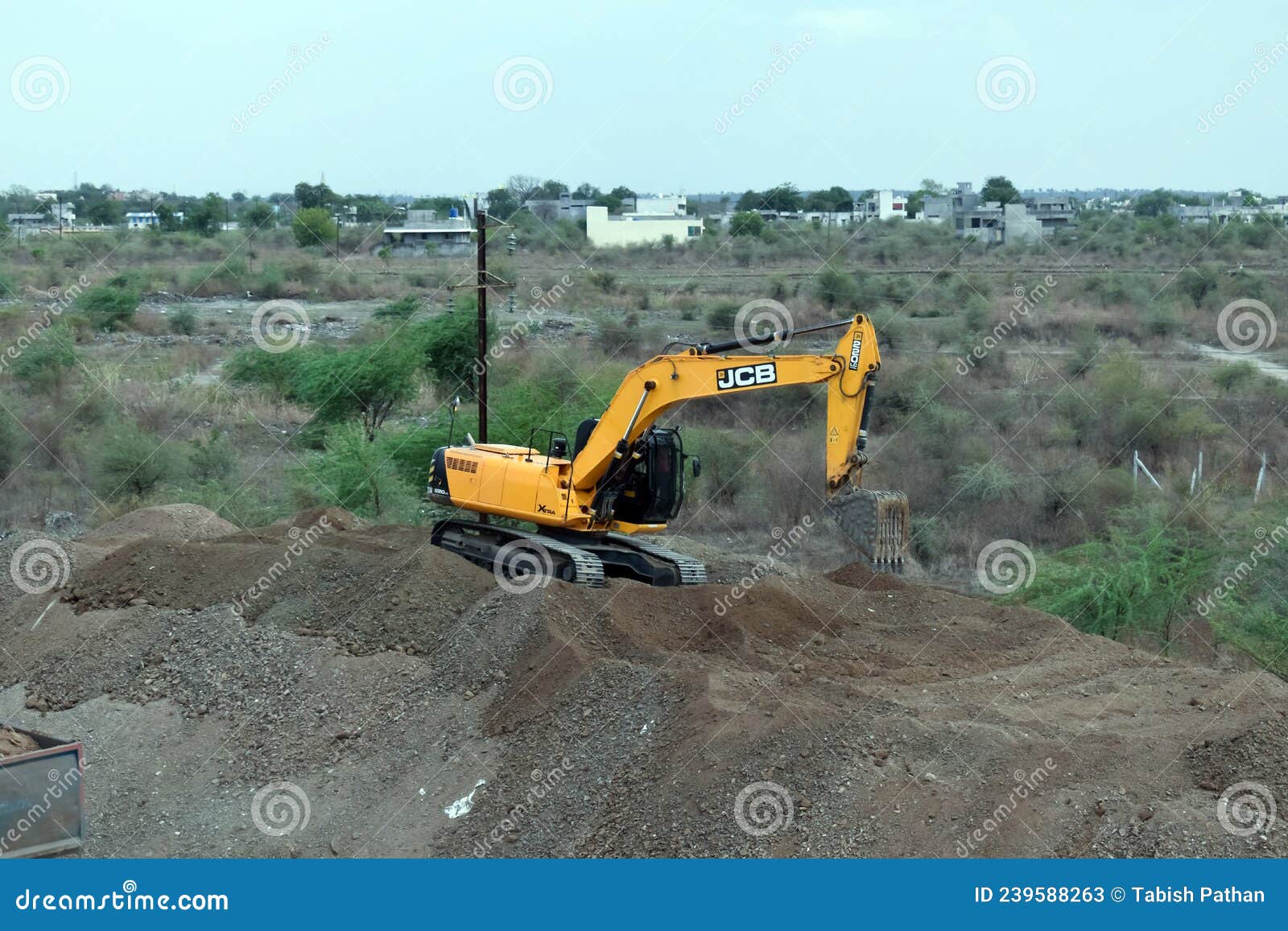 Poclain Machine Working on Construction Site - New Asphalt City Road ...
