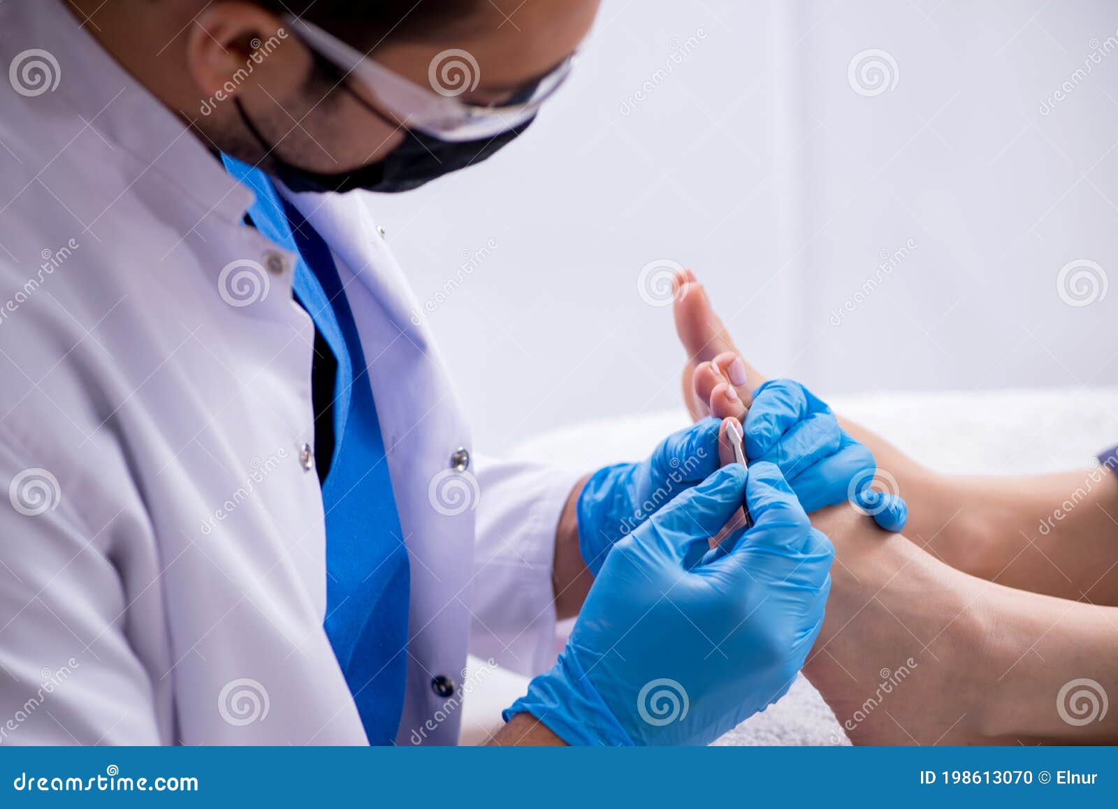 Podiatrist Treating Feet during Procedure Stock Photo - Image of injury ...