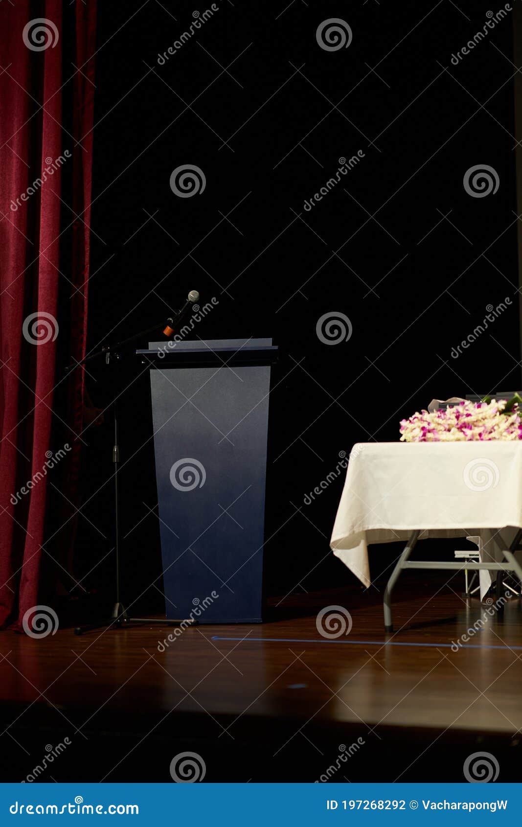 Podium at Graduated Ceremony with Table of Congratulation Flower on ...