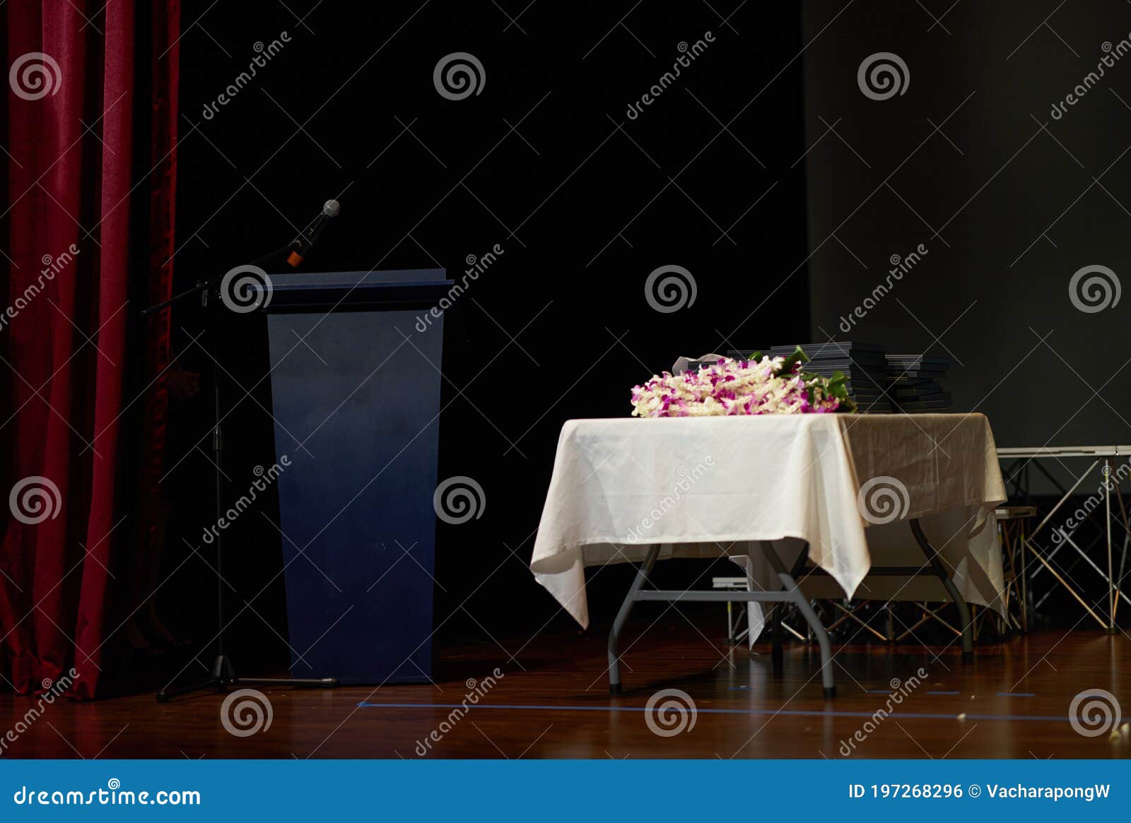 Podium at Graduated Ceremony with Table of Congratulation Flower on ...