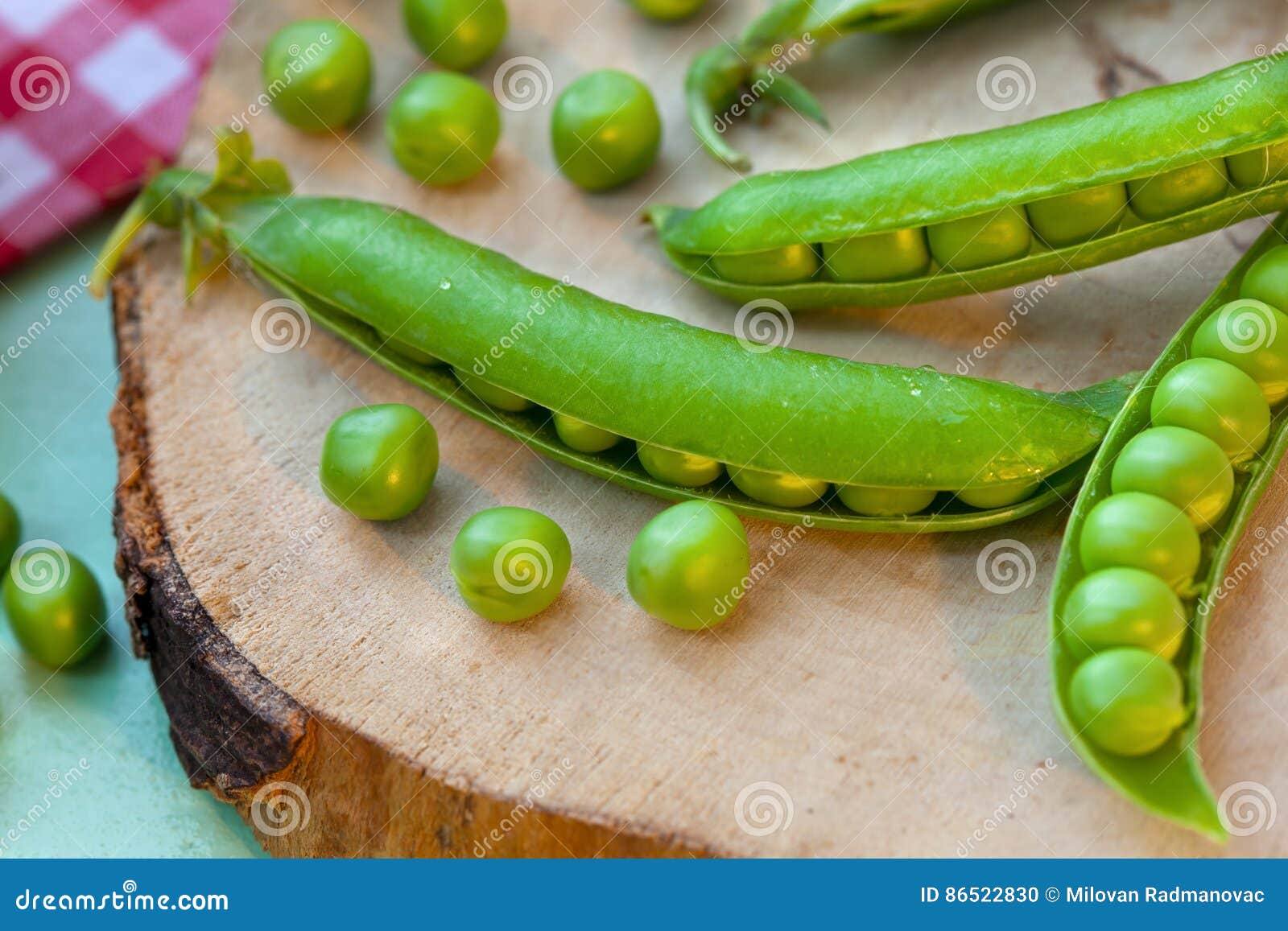 Pods of fresh green peas stock photo. Image of wooden - 86522830