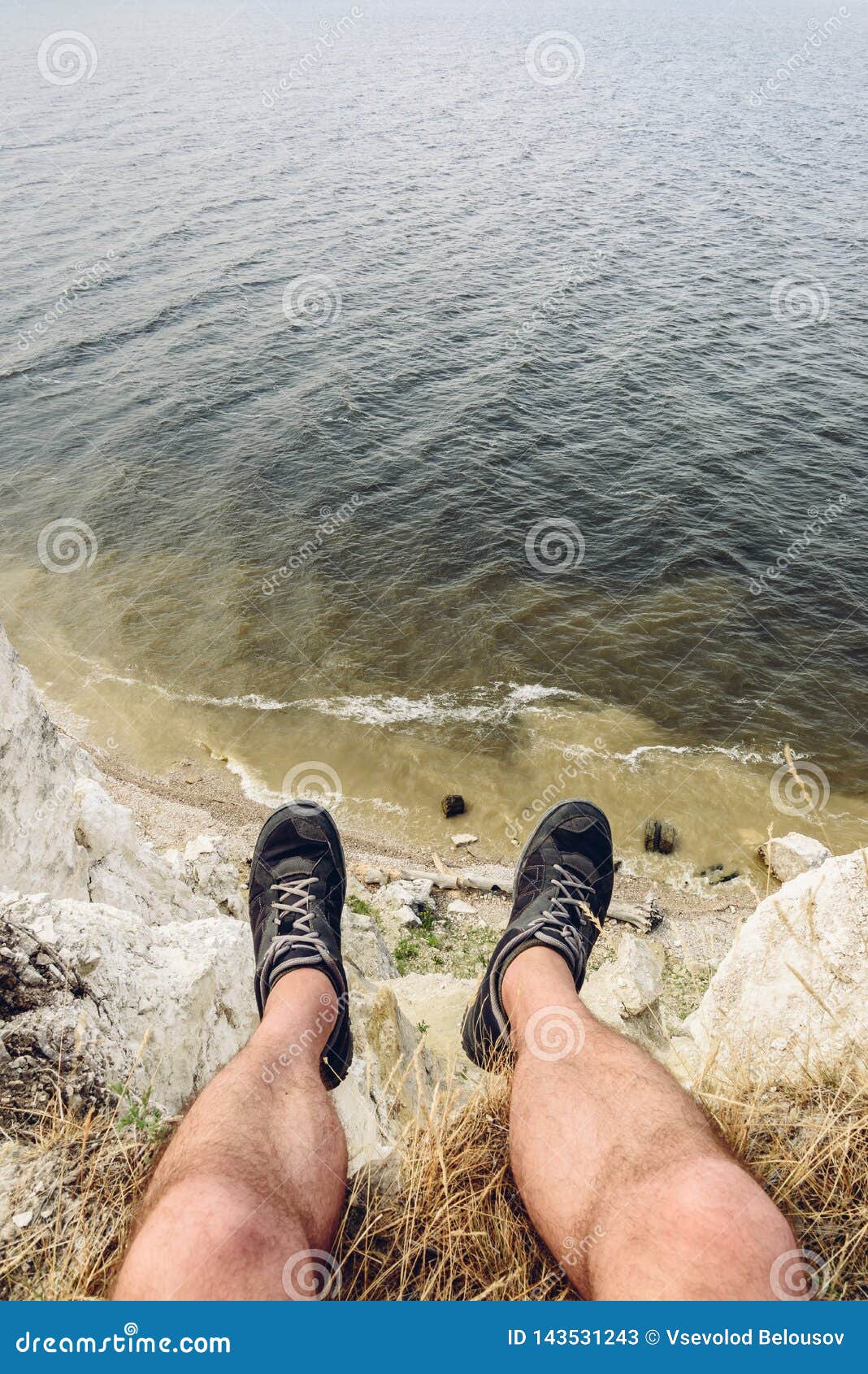Point of View of Man Sitting on the Edge of Cliff Stock Image - Image ...