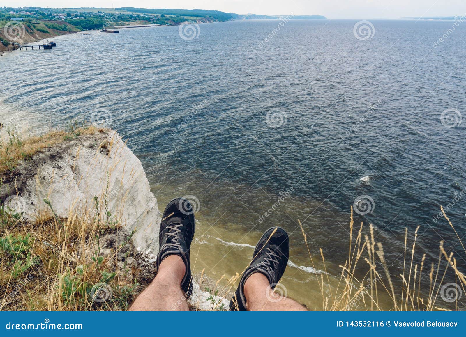 Point of View of Man Sitting on the Edge of Cliff Stock Photo - Image ...