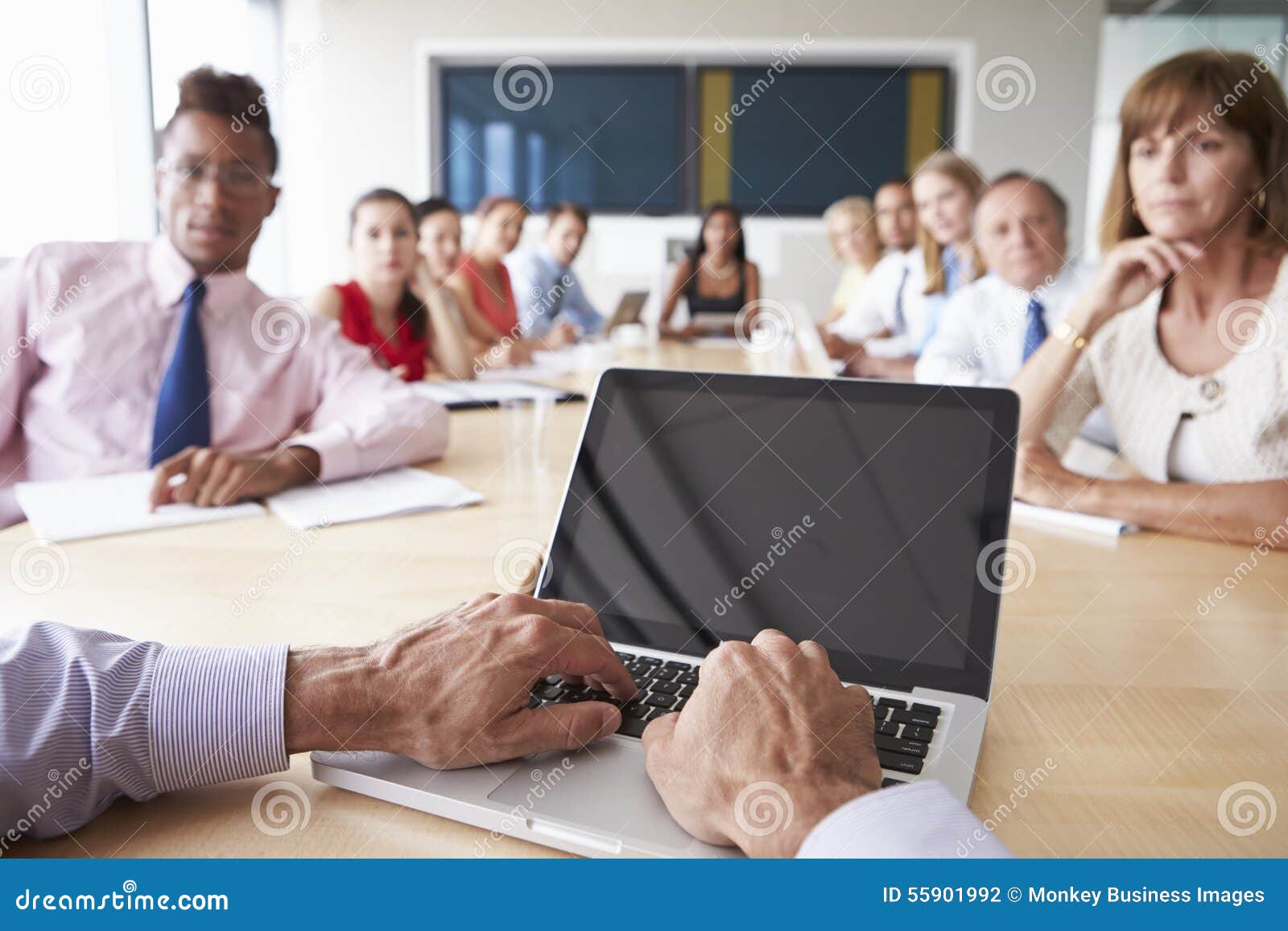 Point of View Shot of Businesspeople Around Boardroom Table Stock Photo ...