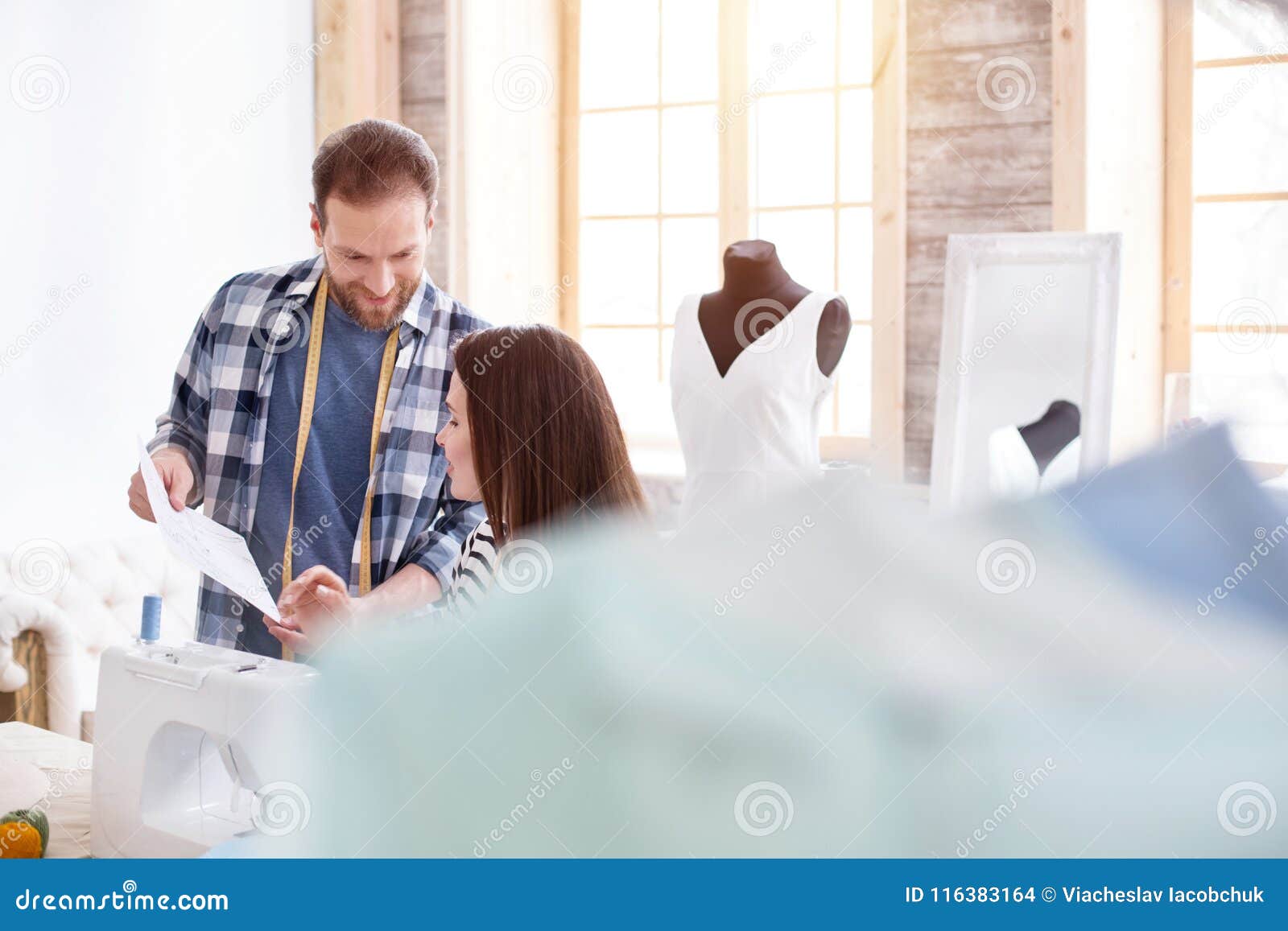 Ambitious Two Tailors Exchanging Ideas Stock Photo - Image of ...