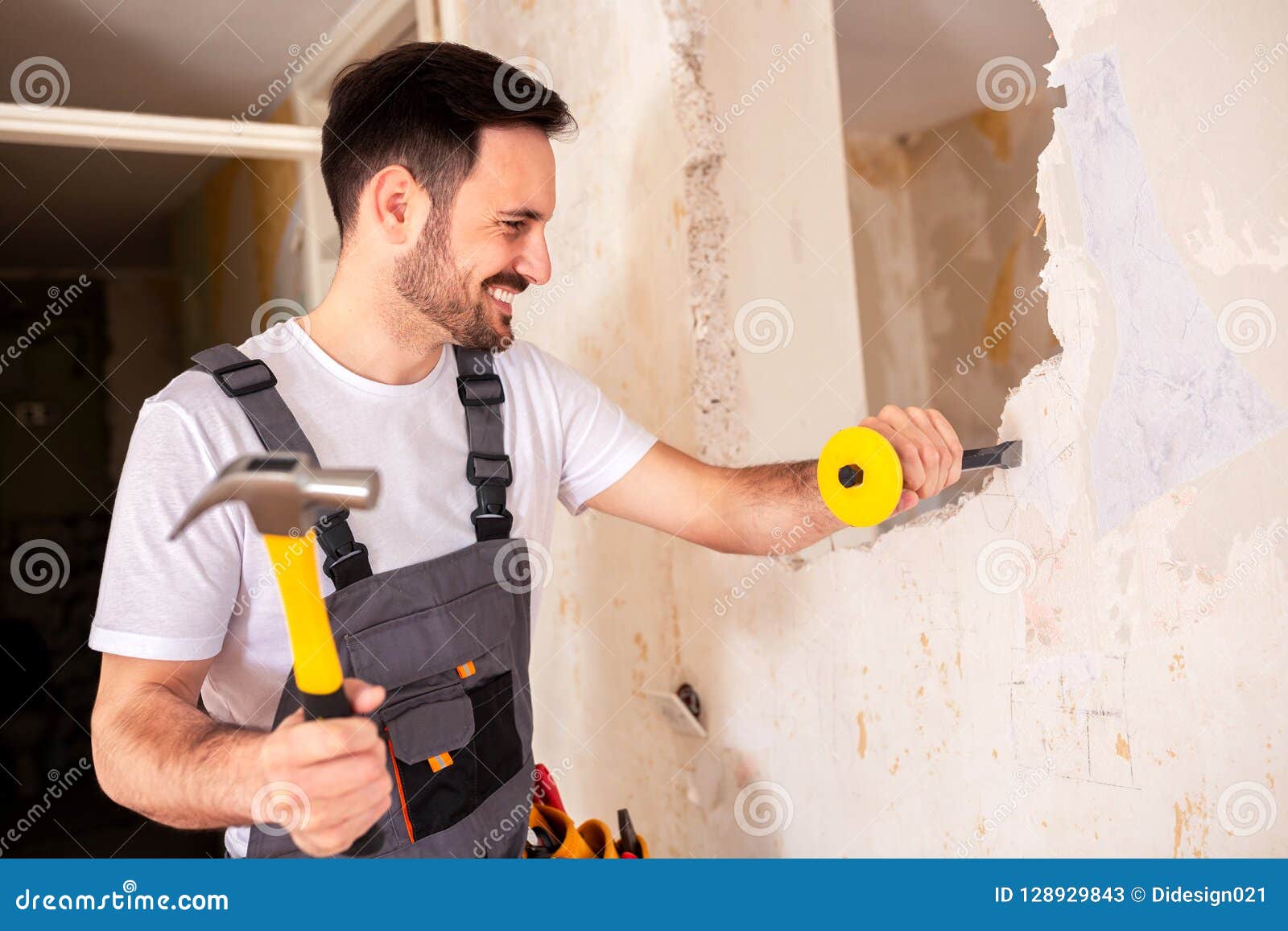 With Pointed Chisel in One Hand and a Hammer in the Other Stock Image ...