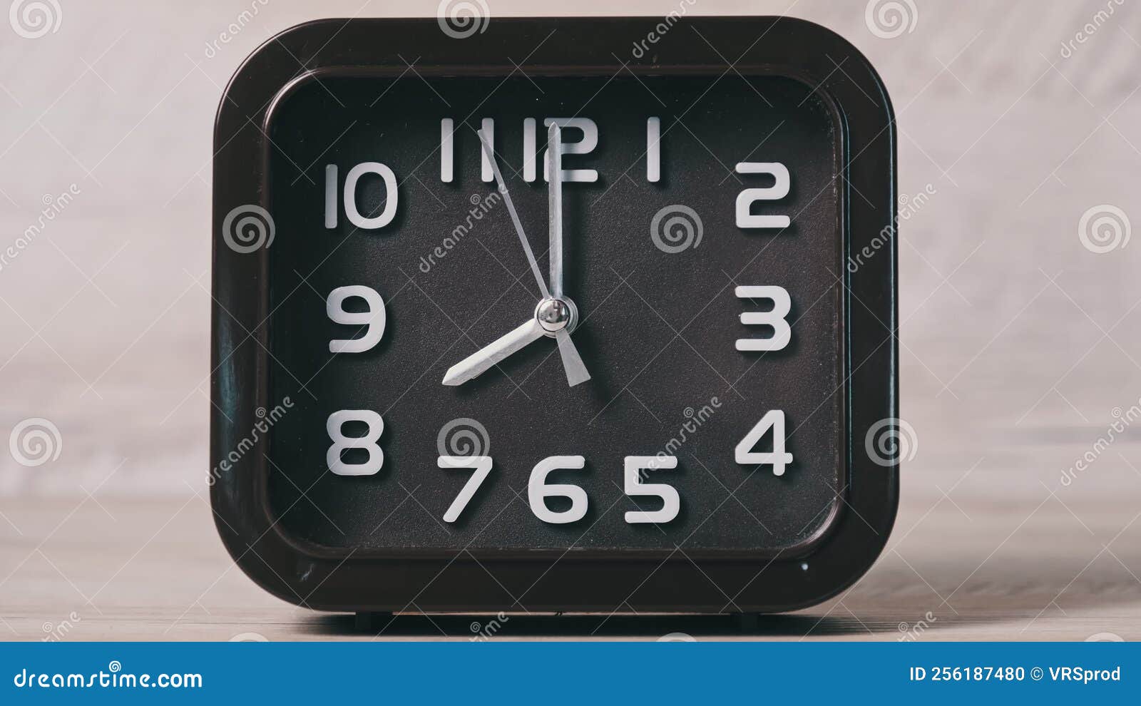 The Pointer Clock of Square Shape on Wooden Table Shows Time 8 Hours ...