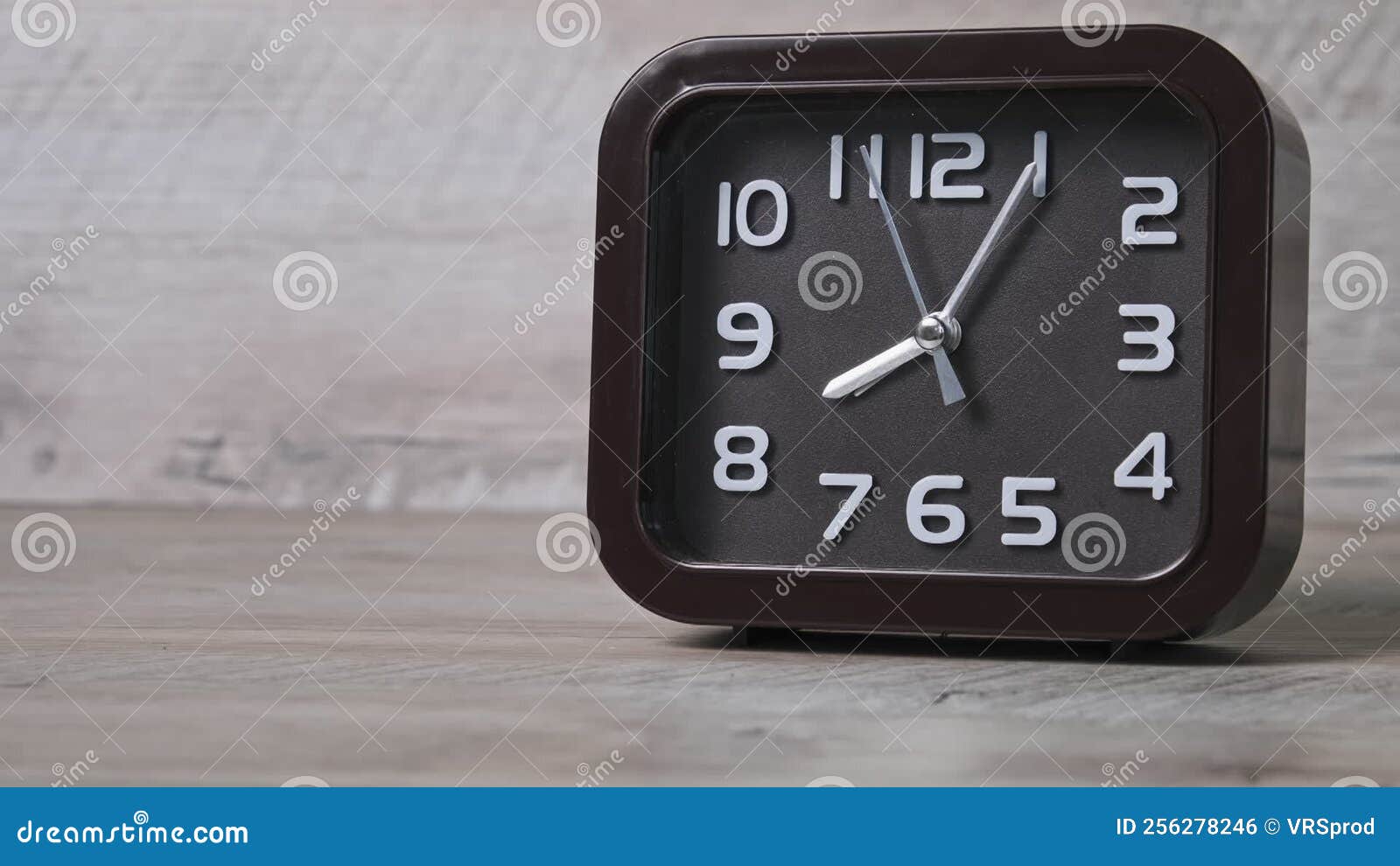 The Pointer Clock of Square Shape on Wooden Table Shows Time 8 Hours ...
