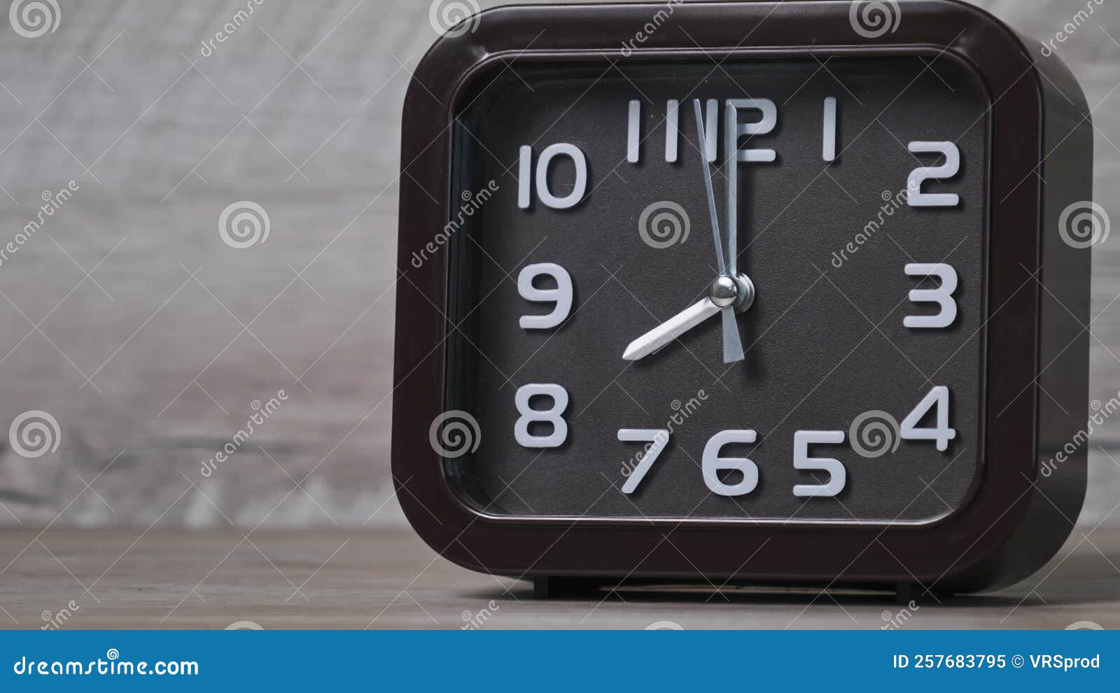 The Pointer Clock of Square Shape on Wooden Table Shows Time 8 Hours ...