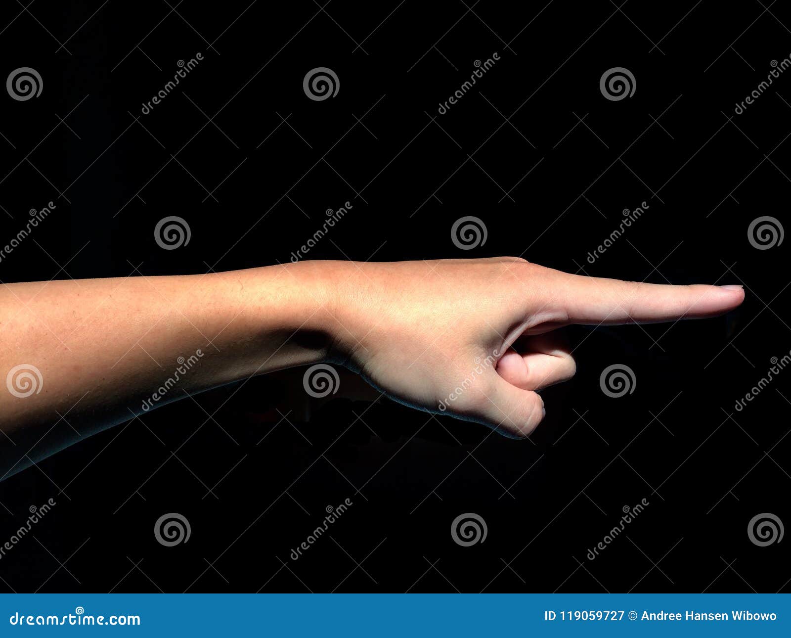 Pointing Hand on an Isolated Black Background Stock Image - Image of ...