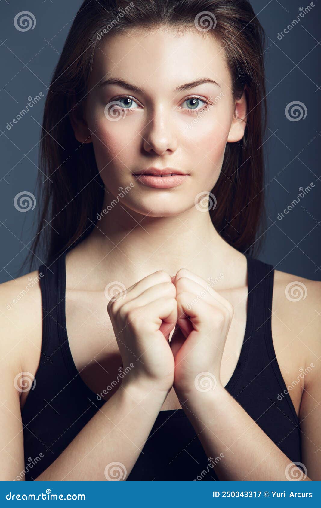 Poised Perfection A Gorgeous Young Woman Looking At The Camera Stock
