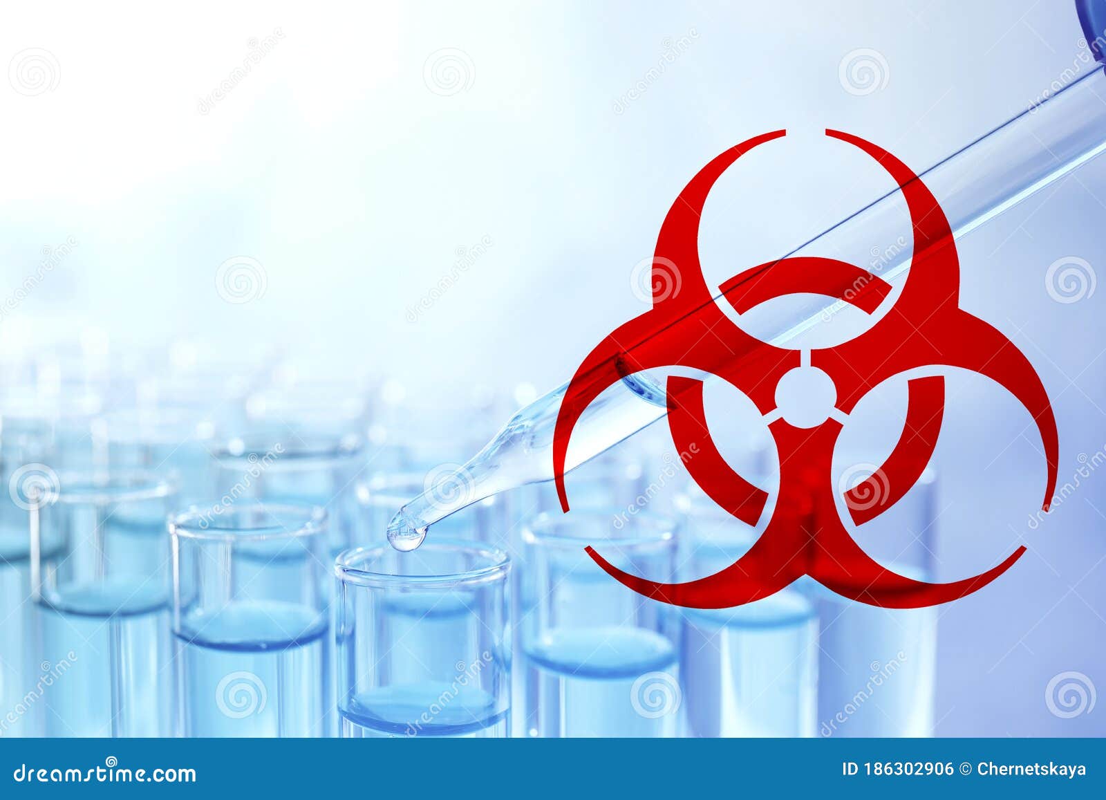 Poison Sign And Dripping Reagent Into Test Tube In Laboratory Royalty ...