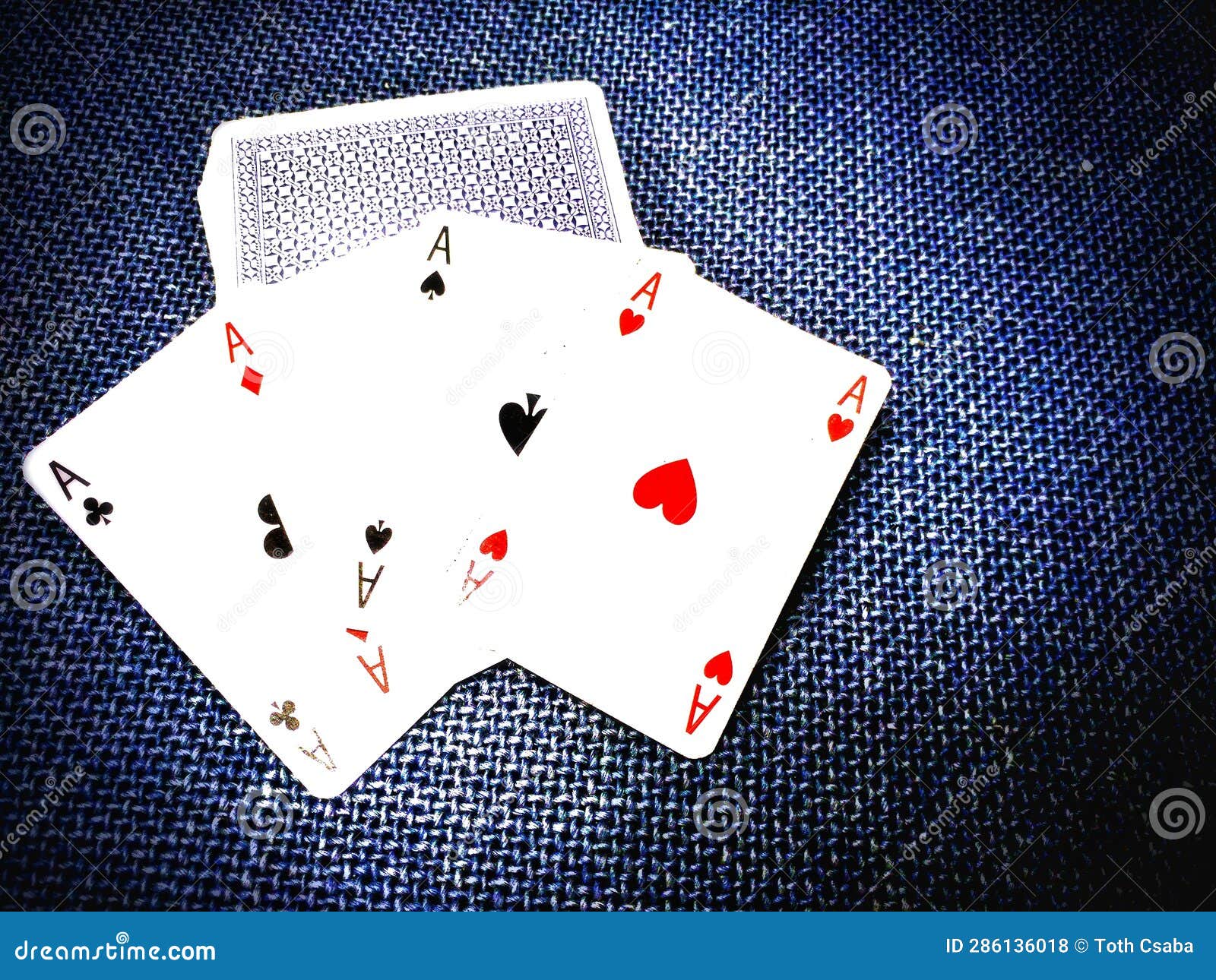 A Deck Of Playing Cards With Coins Lies On A Stack Of Banknotes And ...