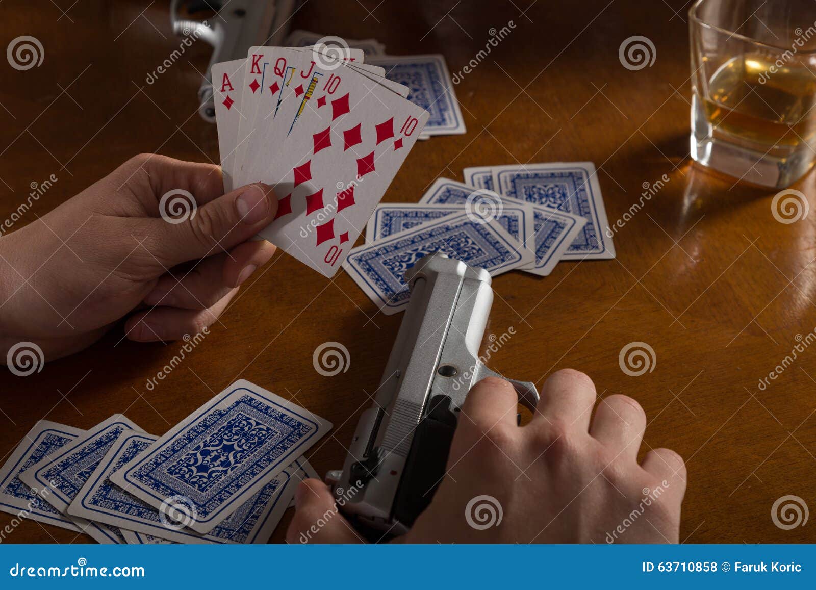 Poker cards and handgun stock photo. Image of person - 63710858