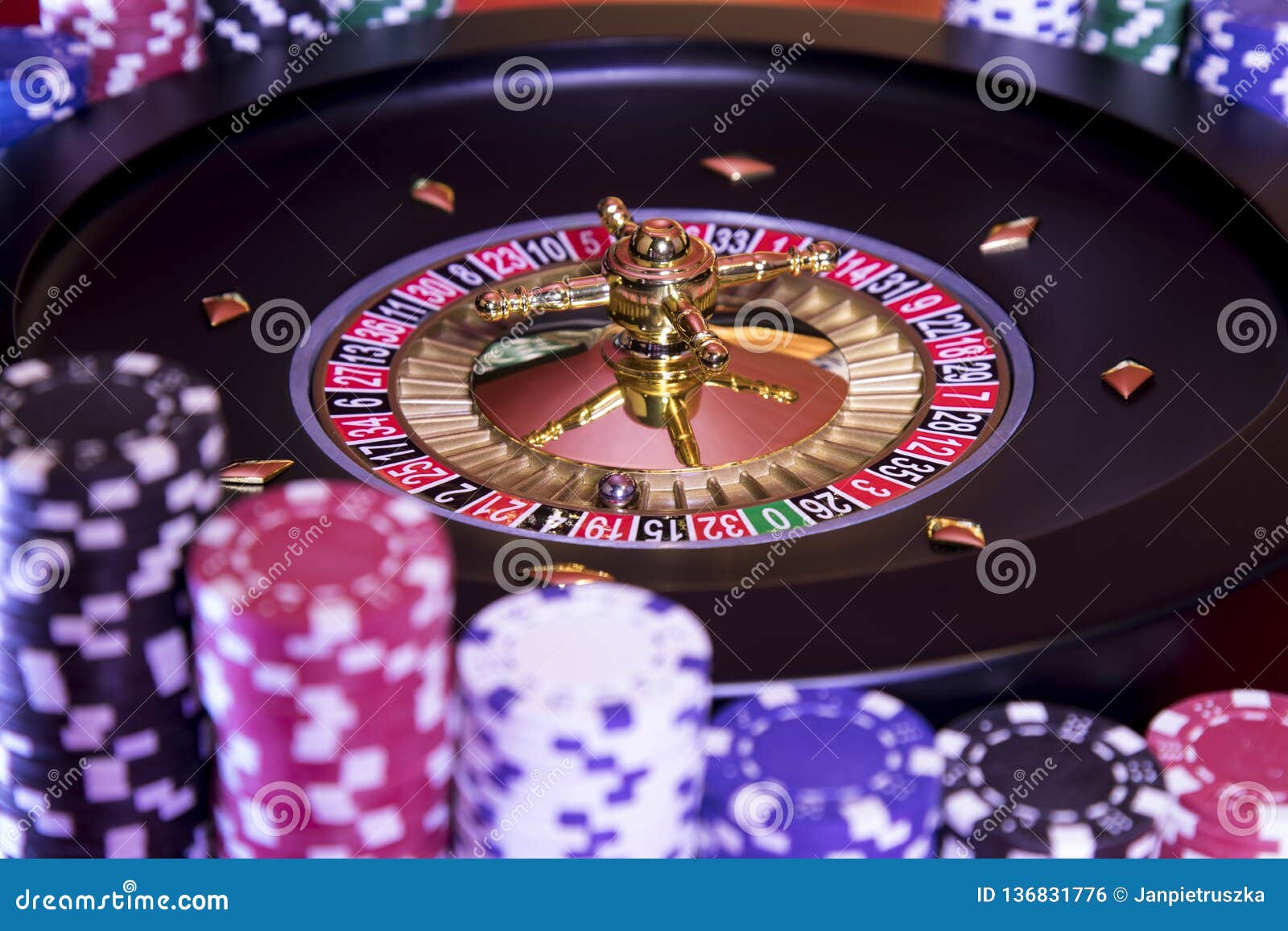 Poker Chips, Roulette Wheel in Motion, Casino Background Stock Photo ...