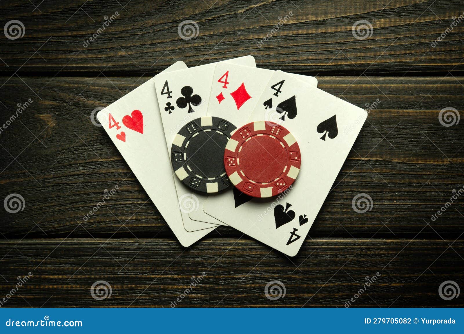 Poker Game with Four of Kind Combination. Chips and Cards on the Black ...