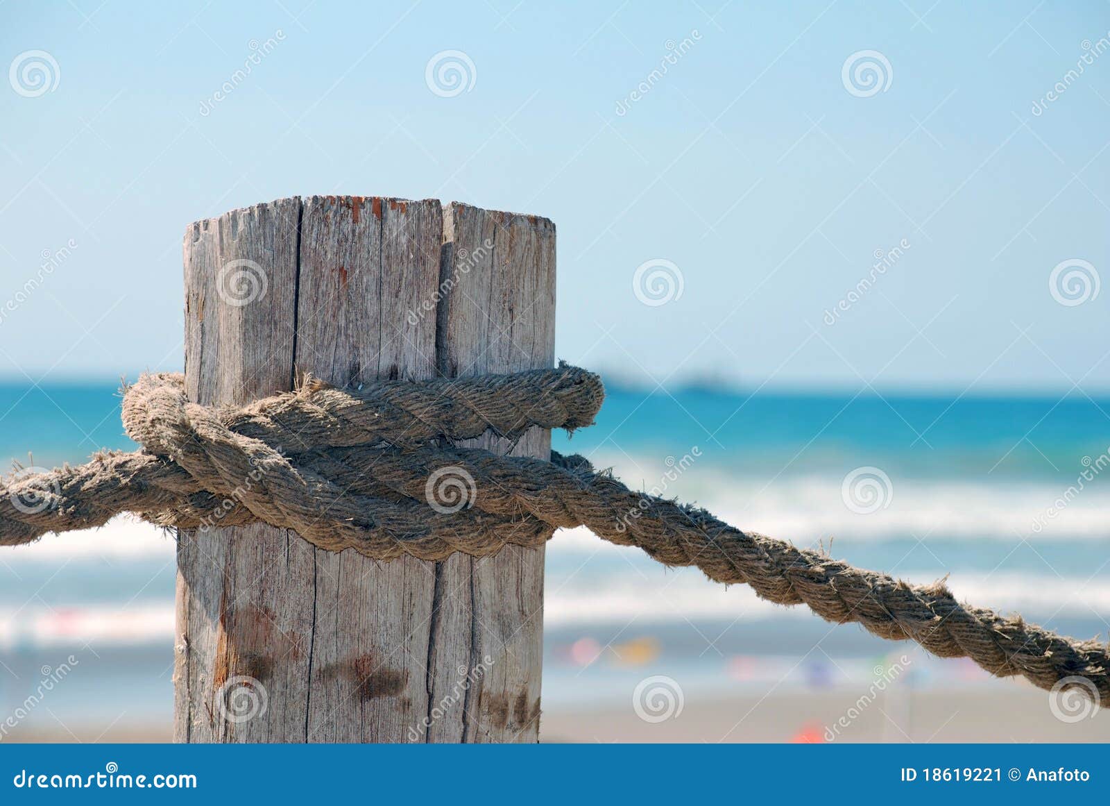 Pole with rope at beach stock image. Image of water, wooden - 18619221