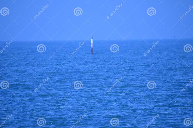 Pole in the sea. stock image. Image of pillar, blue - 106234939