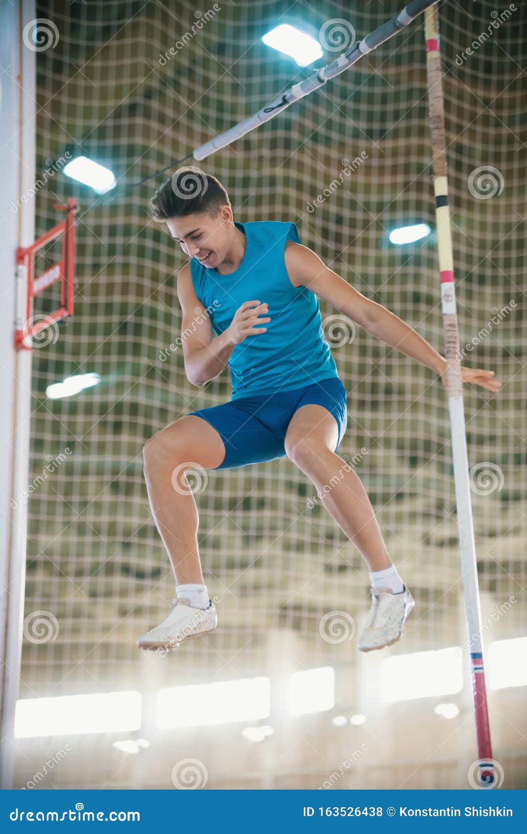 Pole Vaulting - Man is Falling after a Jump with a Pole and Smiling ...