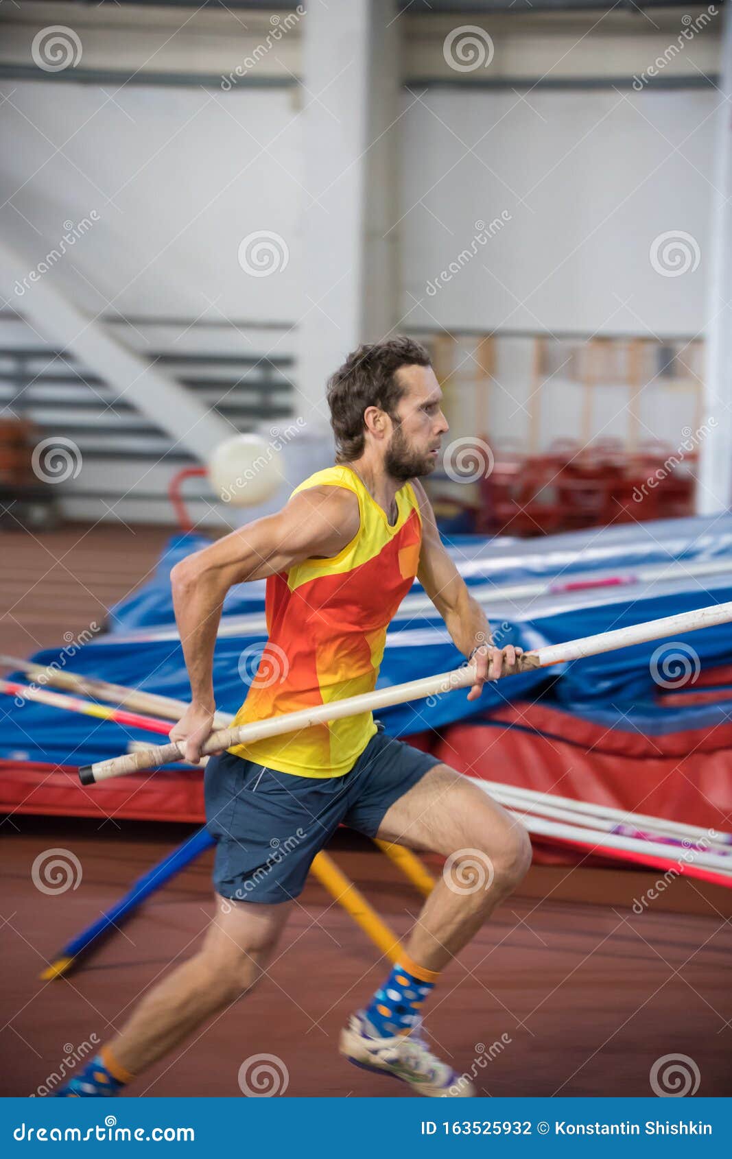 Pole Vaulting - Man is Running with Pole in Hands Stock Photo - Image ...