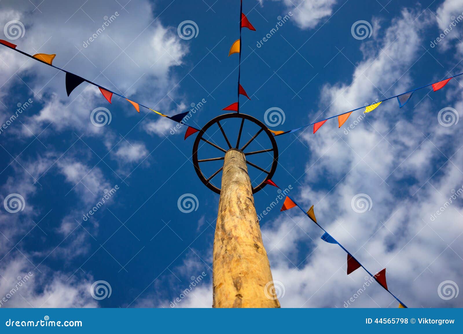 Pole Wheel and Colored Flags on Sky Background Stock Photo - Image of ...