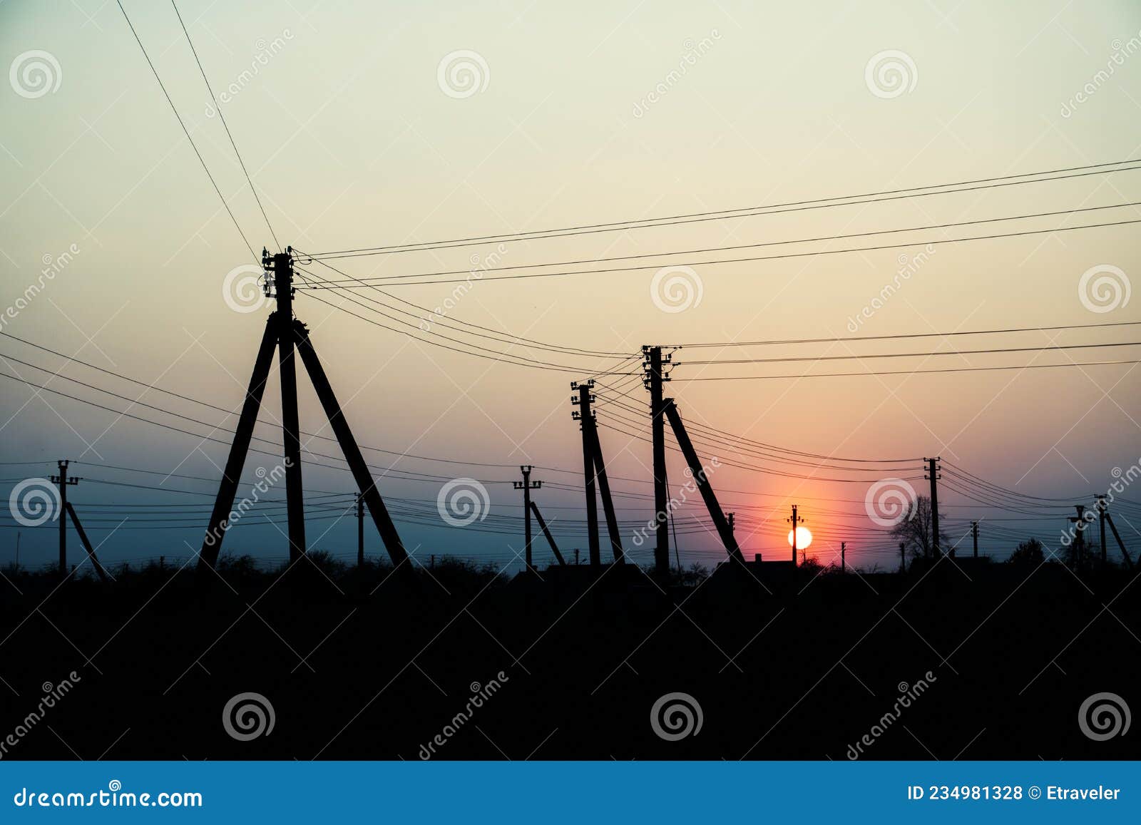 Poles of Electrical Lines in the Sunset Background Stock Photo - Image ...