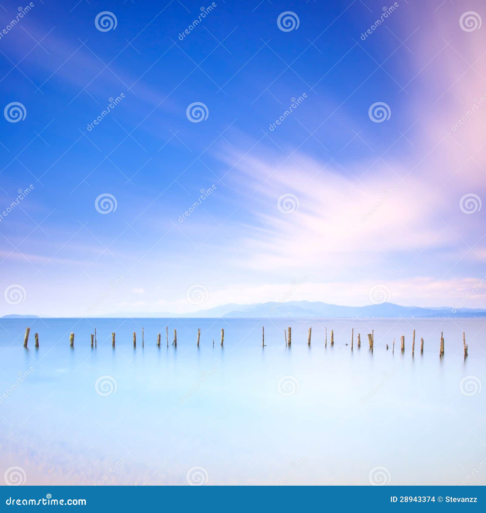 Poles and Soft Water on Sea Landscape. Long Exposure. Stock Photo ...