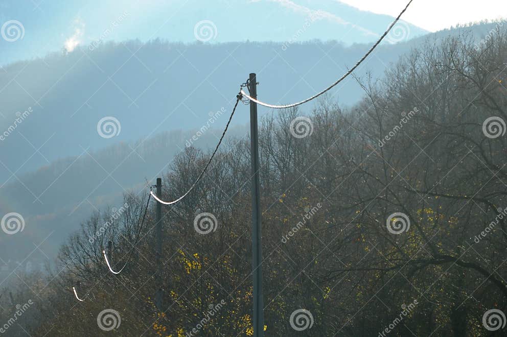 Poles with Wire on the Hill Stock Photo - Image of winter, bridge ...