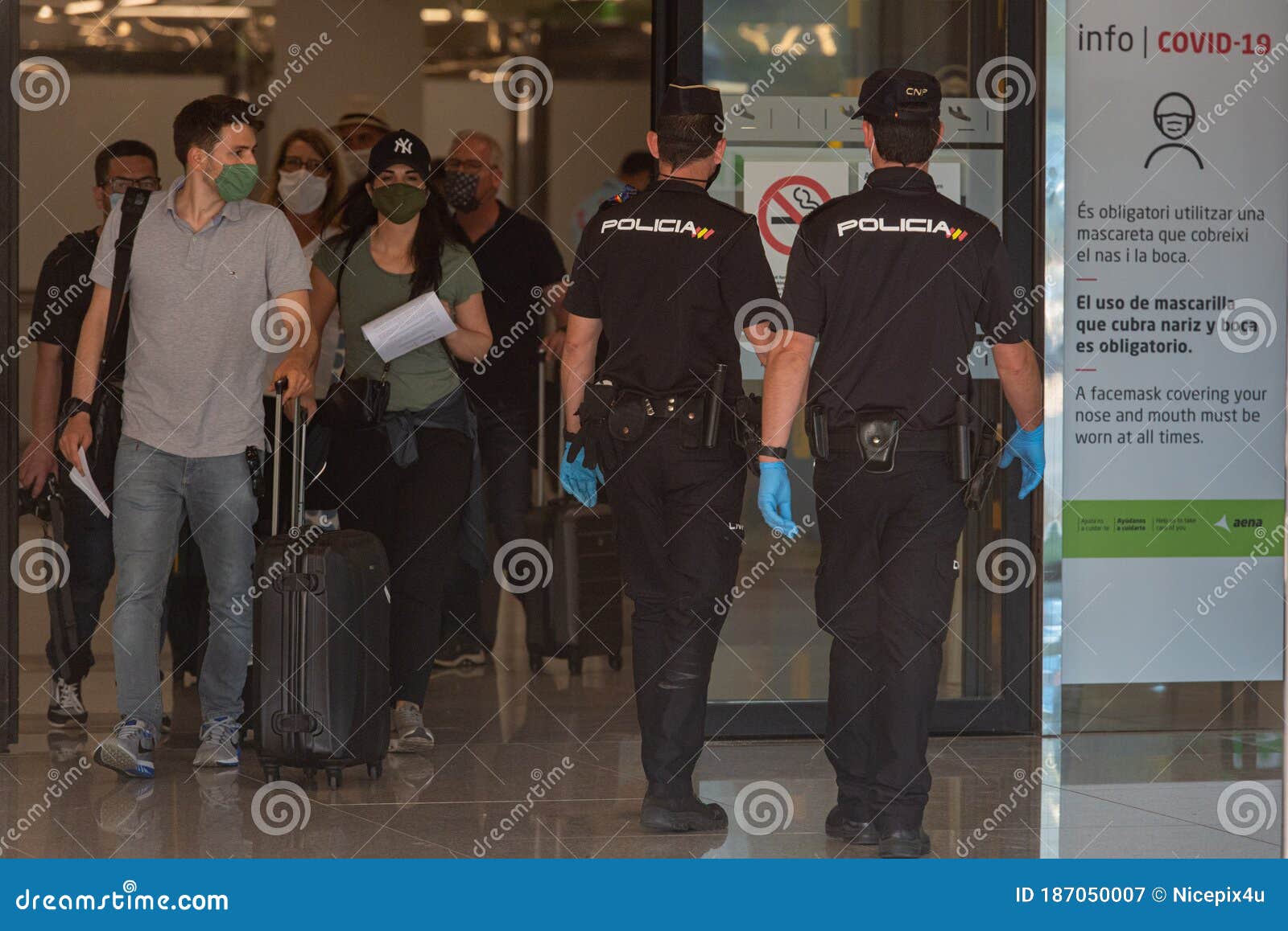 Polica National Controls Arriving Tourists At The Palma Airpor