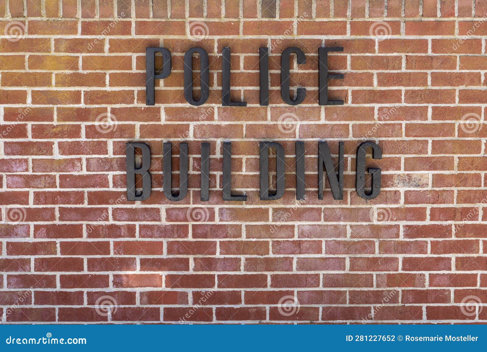 Police Building Black Letters on a Brick Wall Stock Photo - Image of ...