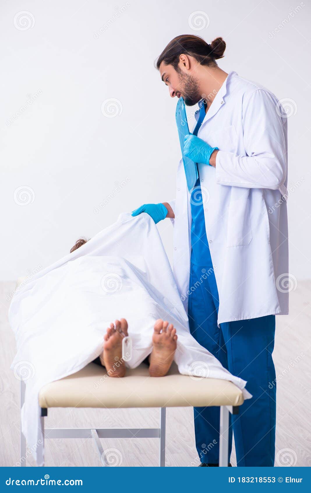 Police Coroner Examining Dead Body Corpse in Morgue Stock Image - Image ...