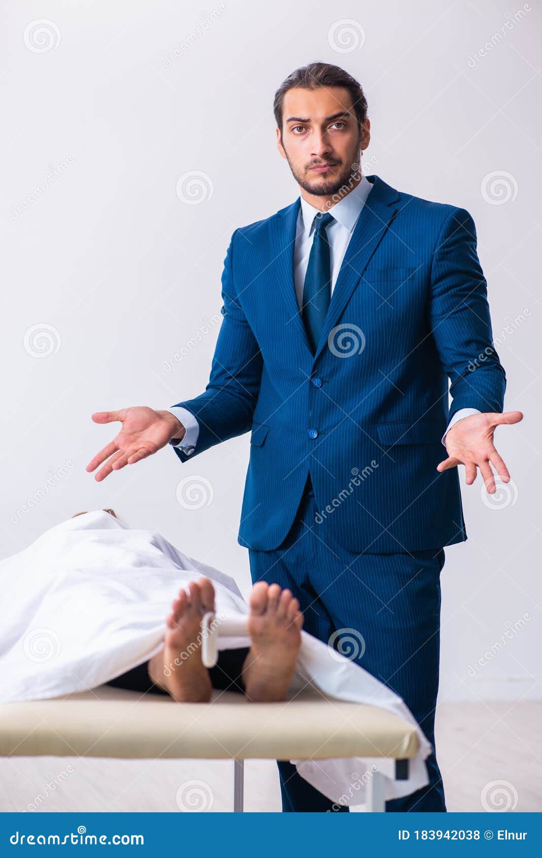 Police Coroner Examining Dead Body Corpse in Morgue Stock Photo - Image ...
