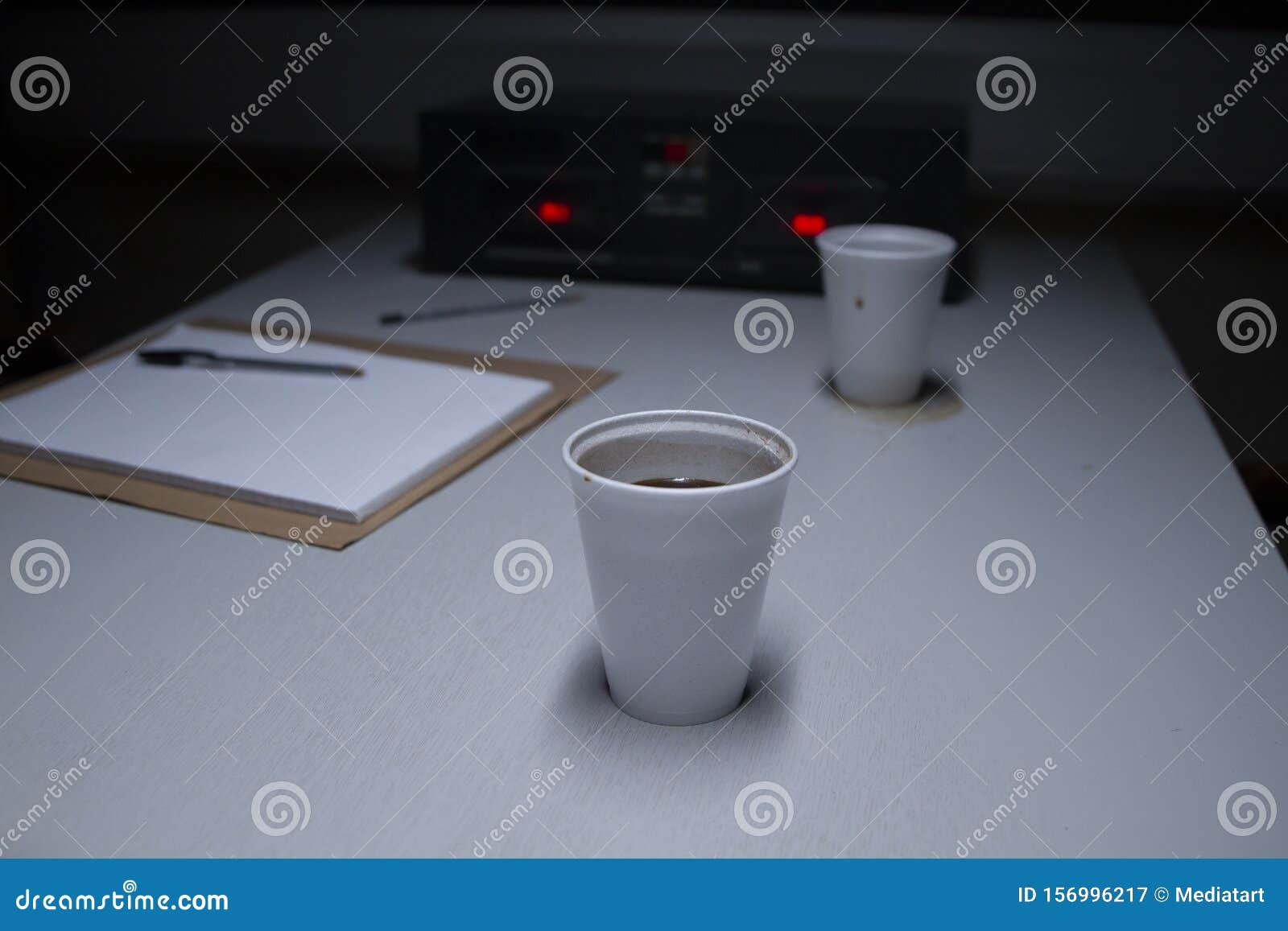 Police Custody Interview Room with Documents and Coffee Cups Stock ...